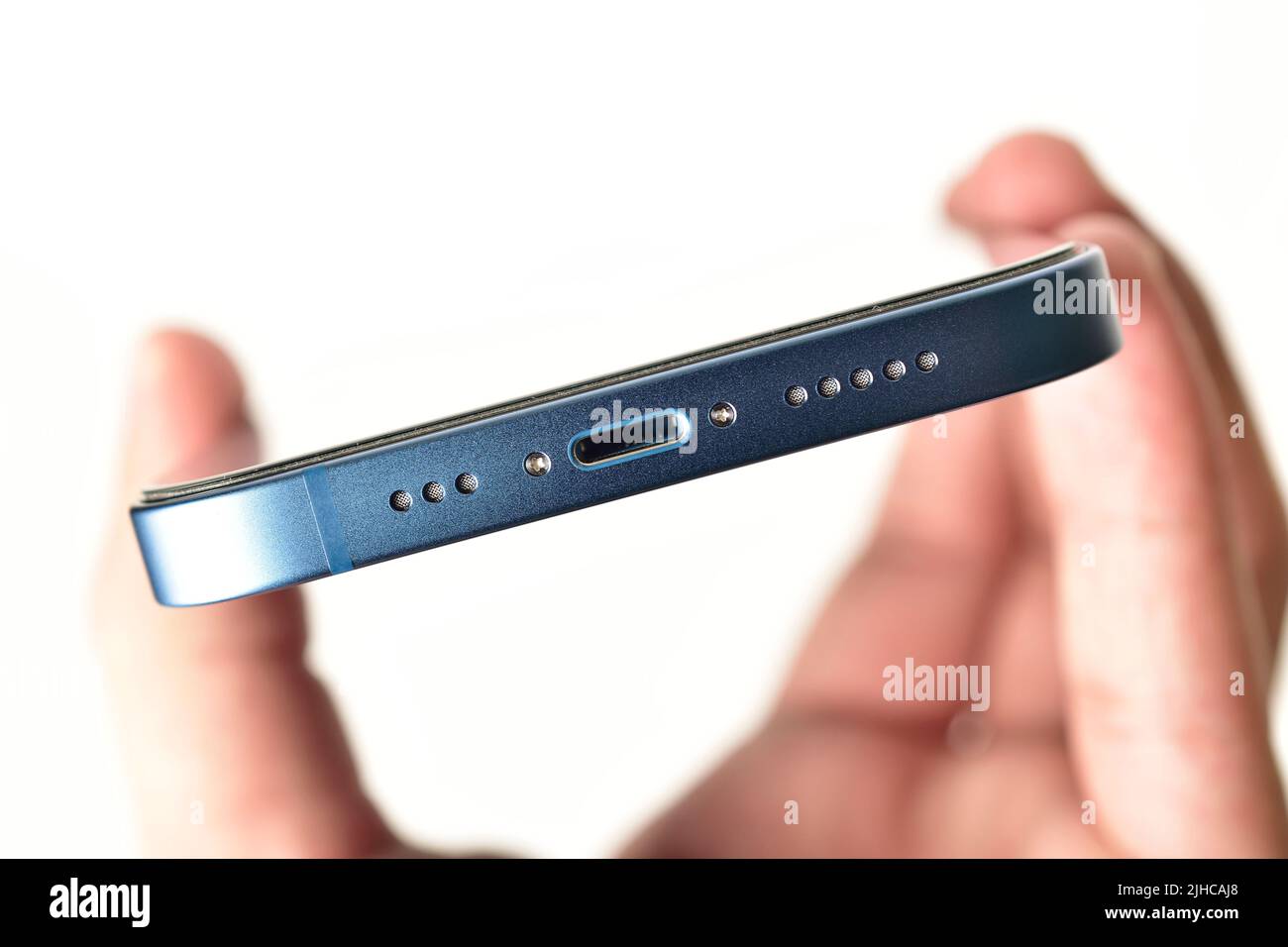 Close up of iphone's charging port with speaker and microphone isolated ...