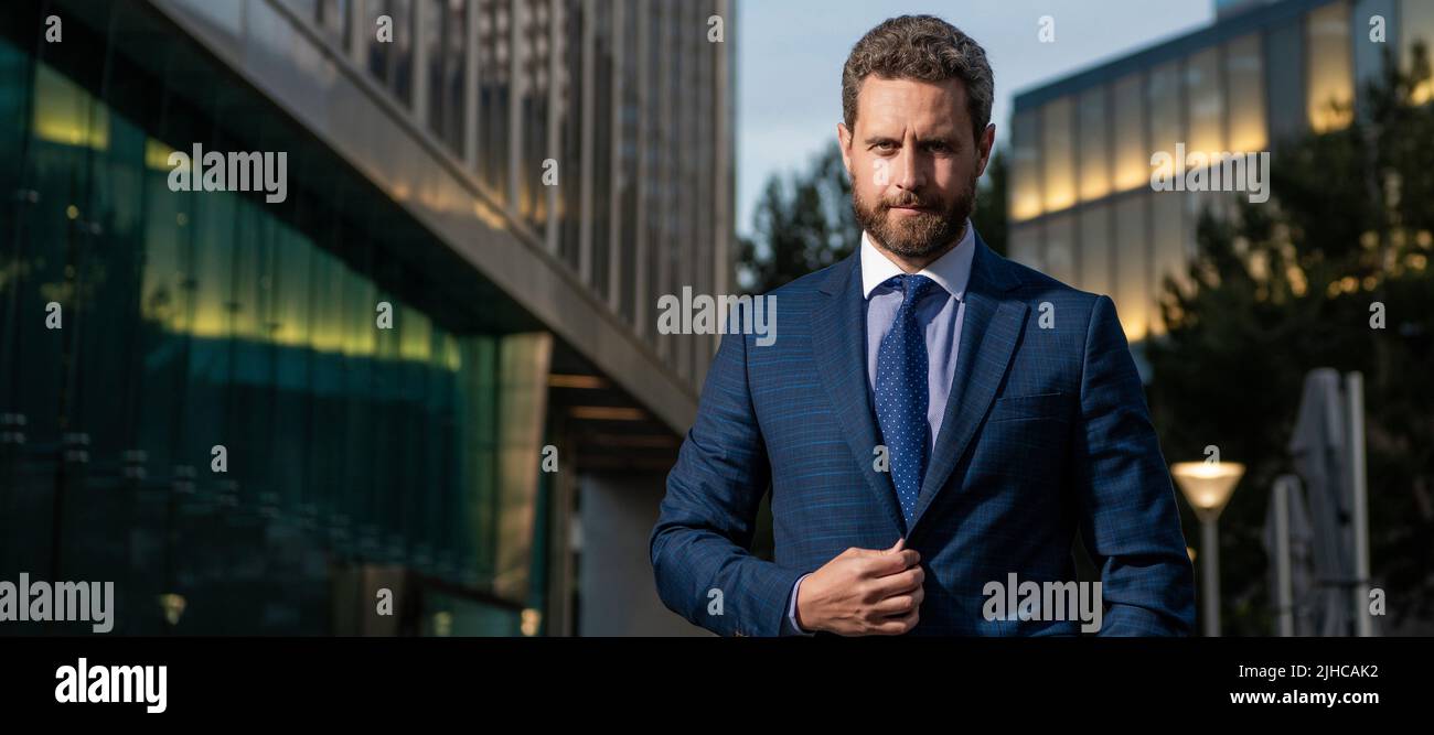 successful man in businesslike suit. manager executive outside the ...