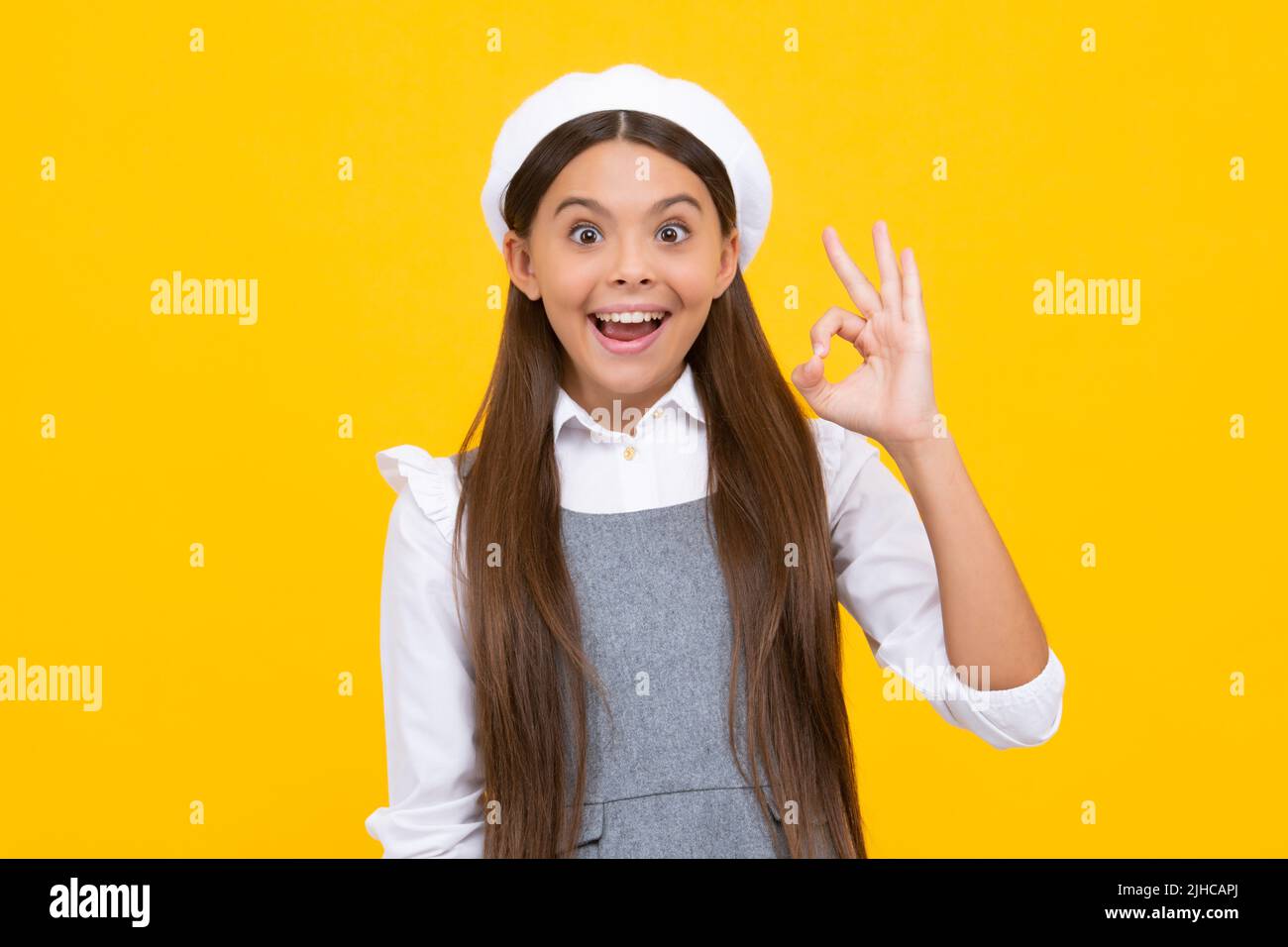 Portrait of teen girl making ok gesture, isolated background. Young ...