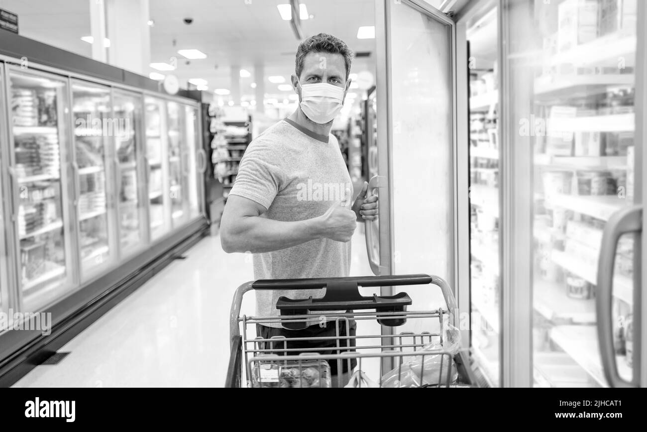 guy at grocery store. shopper at groceries. buying food at supermarket ...