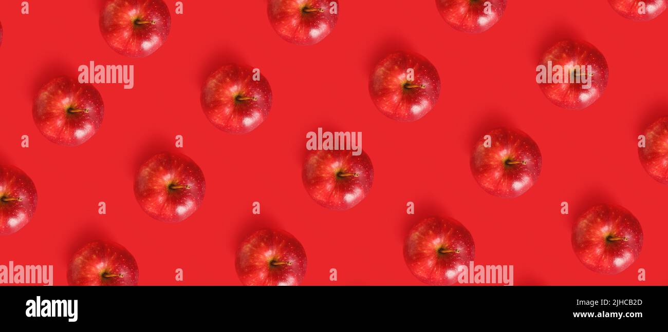 Fresh apples on red background. Pattern for design Stock Photo - Alamy
