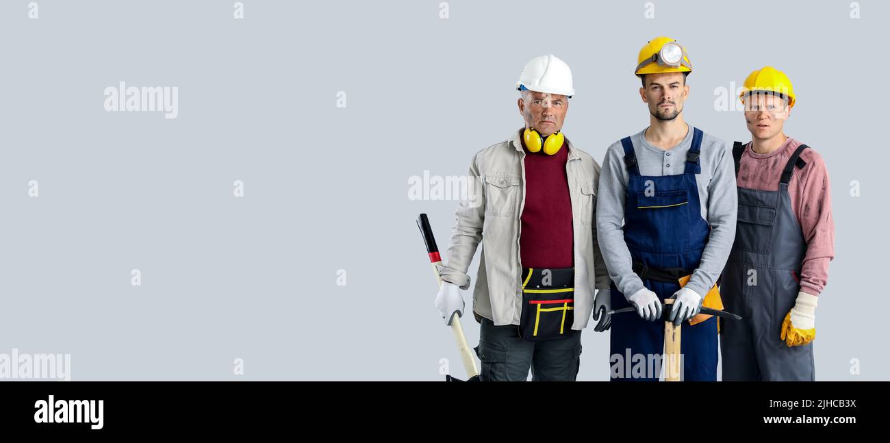 Miner men on grey background with space for text Stock Photo - Alamy