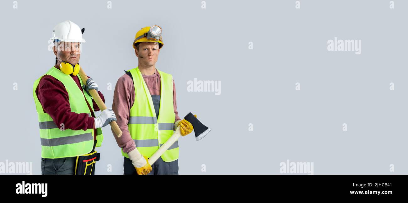 Miner men on grey background with space for text Stock Photo - Alamy