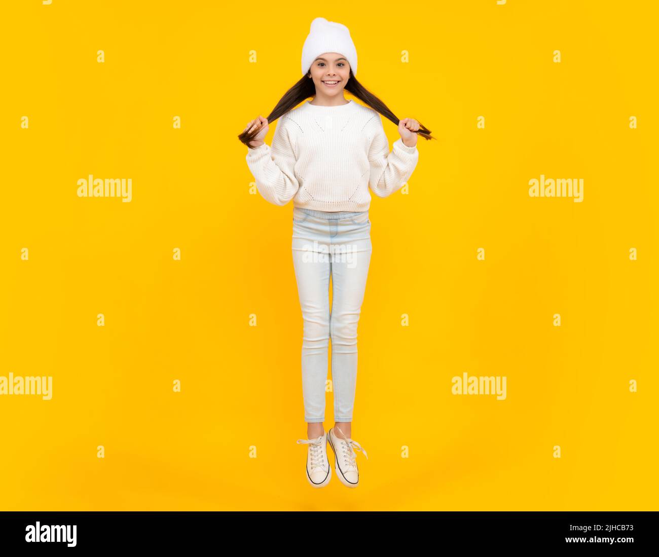 Happiness, activity and child. Teenager girl jumping on isolated ...