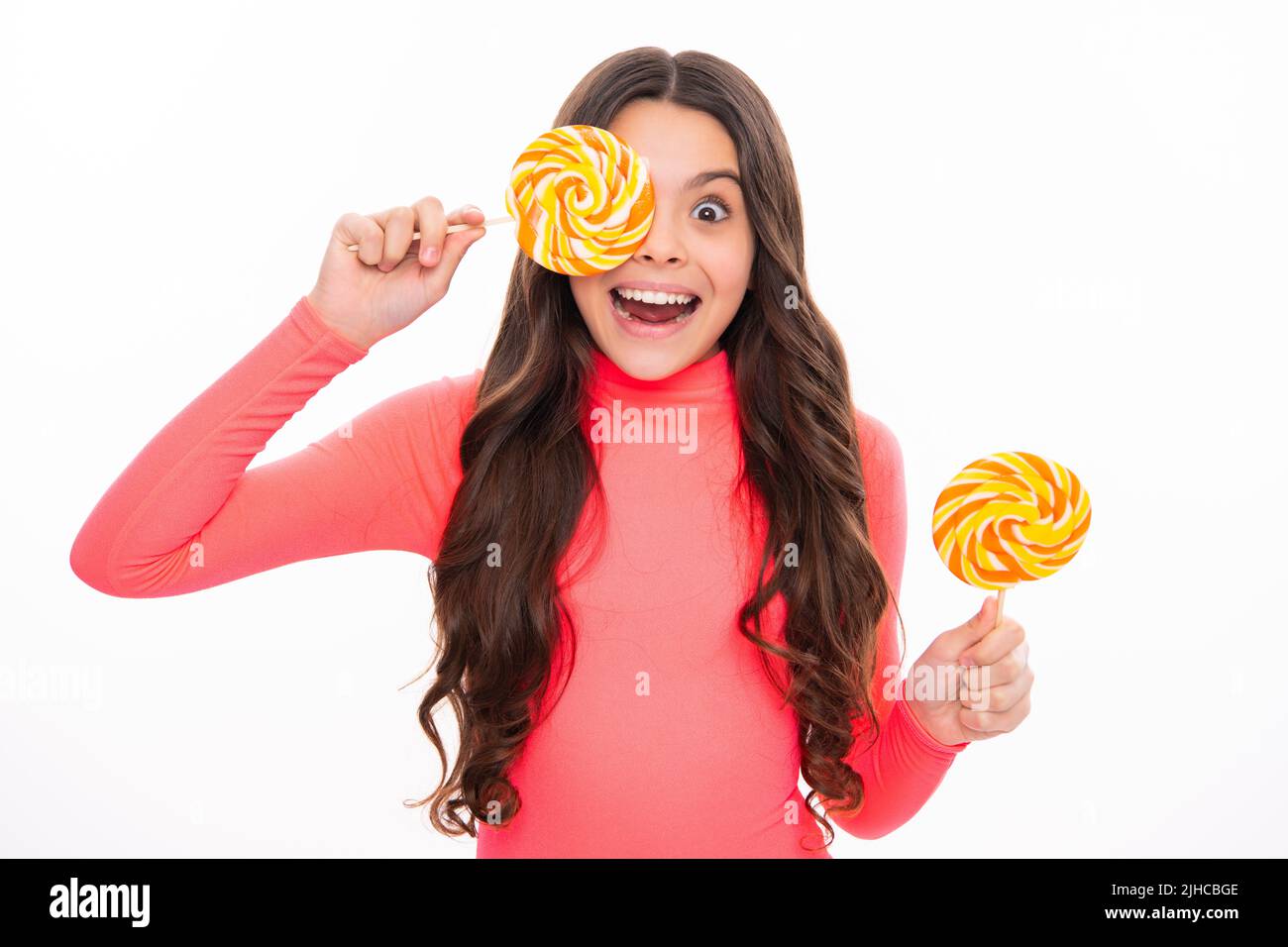 Teenager girl eating sugar lollypop. Candy and sweets for kids. Child ...