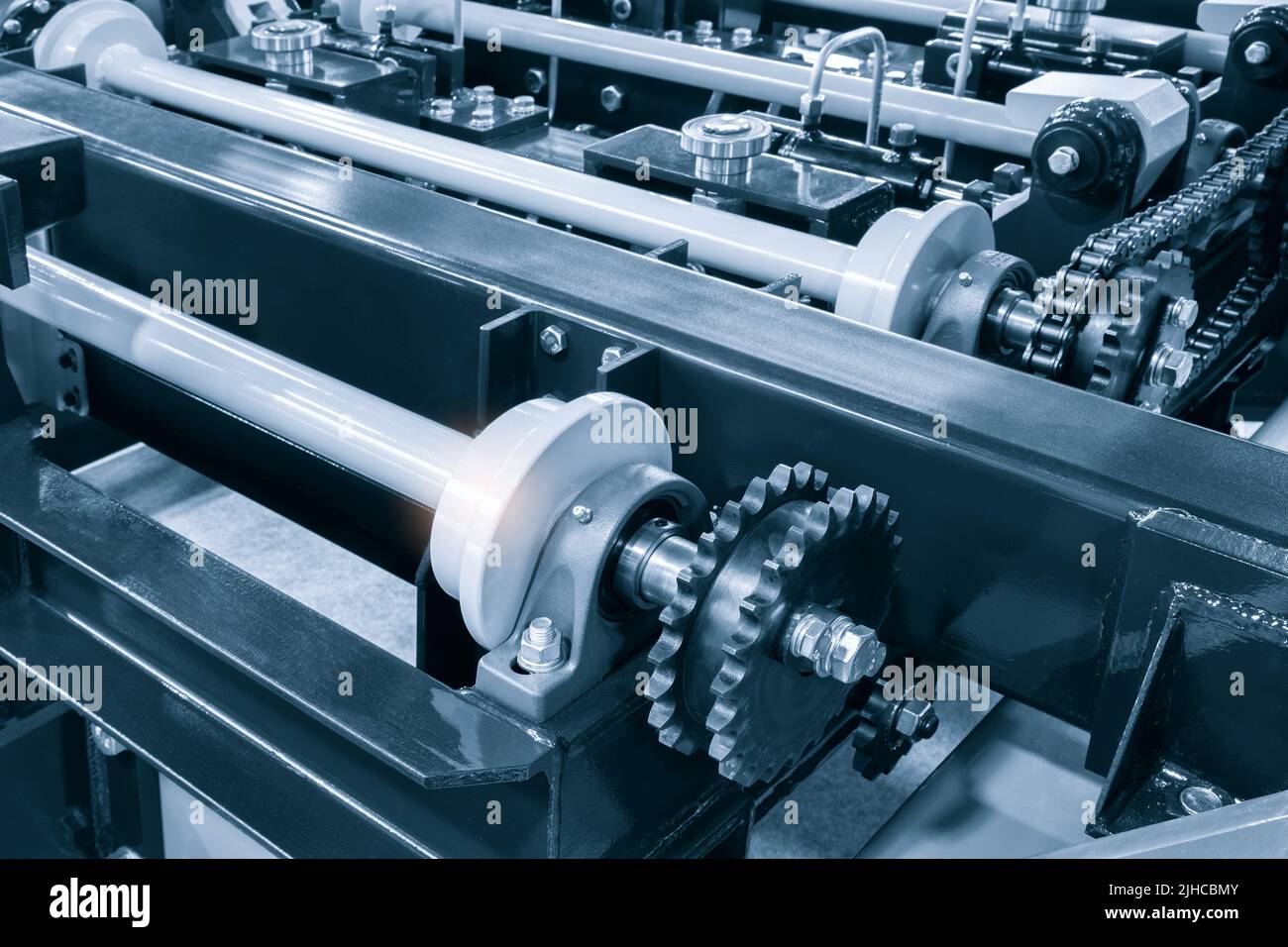 Gear chain drive shaft in conveyor belt is on production line. Timing ...