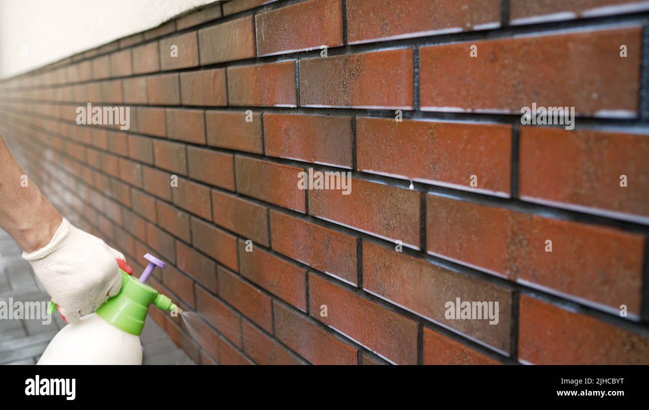 Waterproofing the facade of the building with a special solution ...
