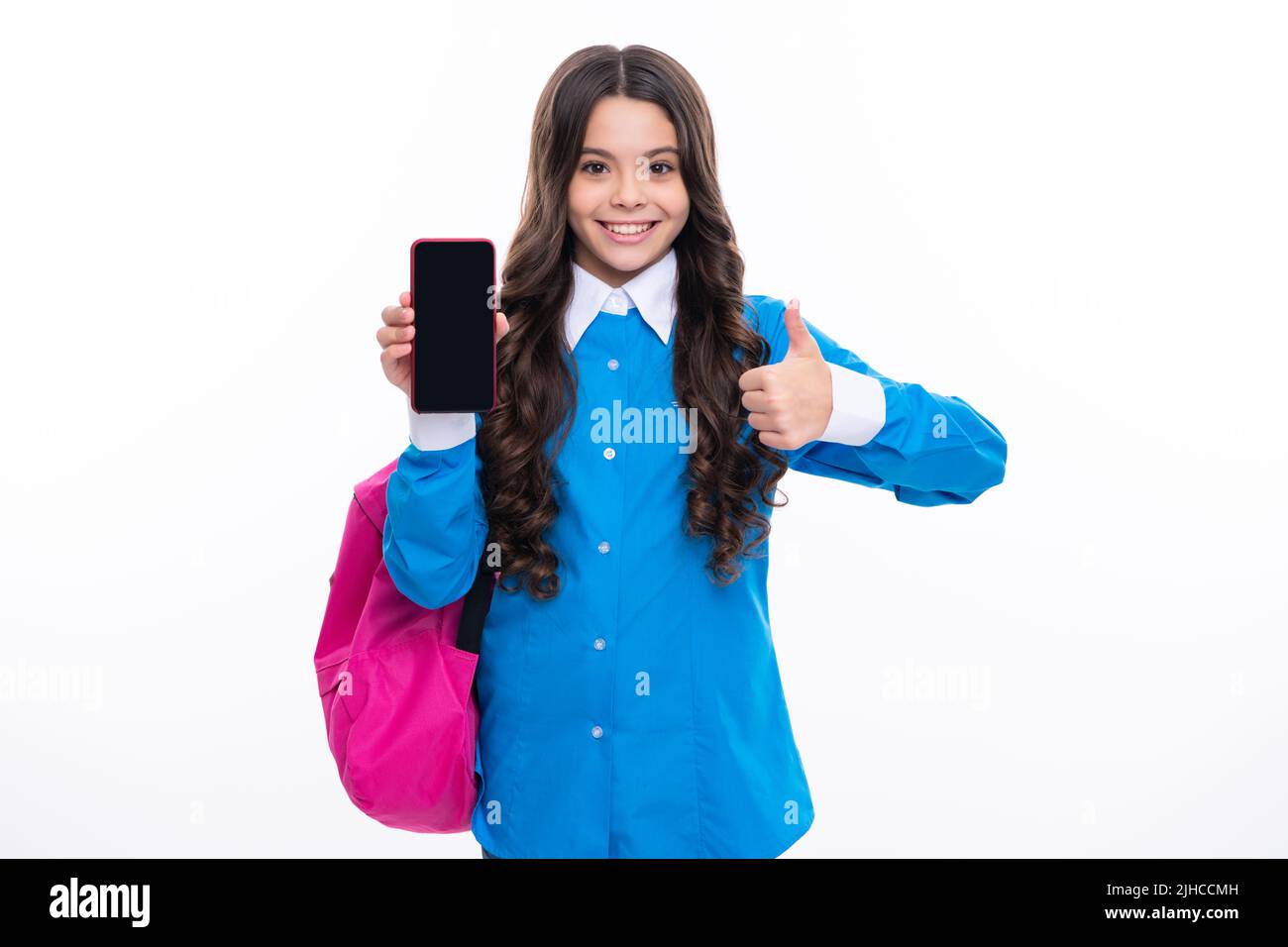 Schoolgirl student with school bag using smart phone. School uniform ...