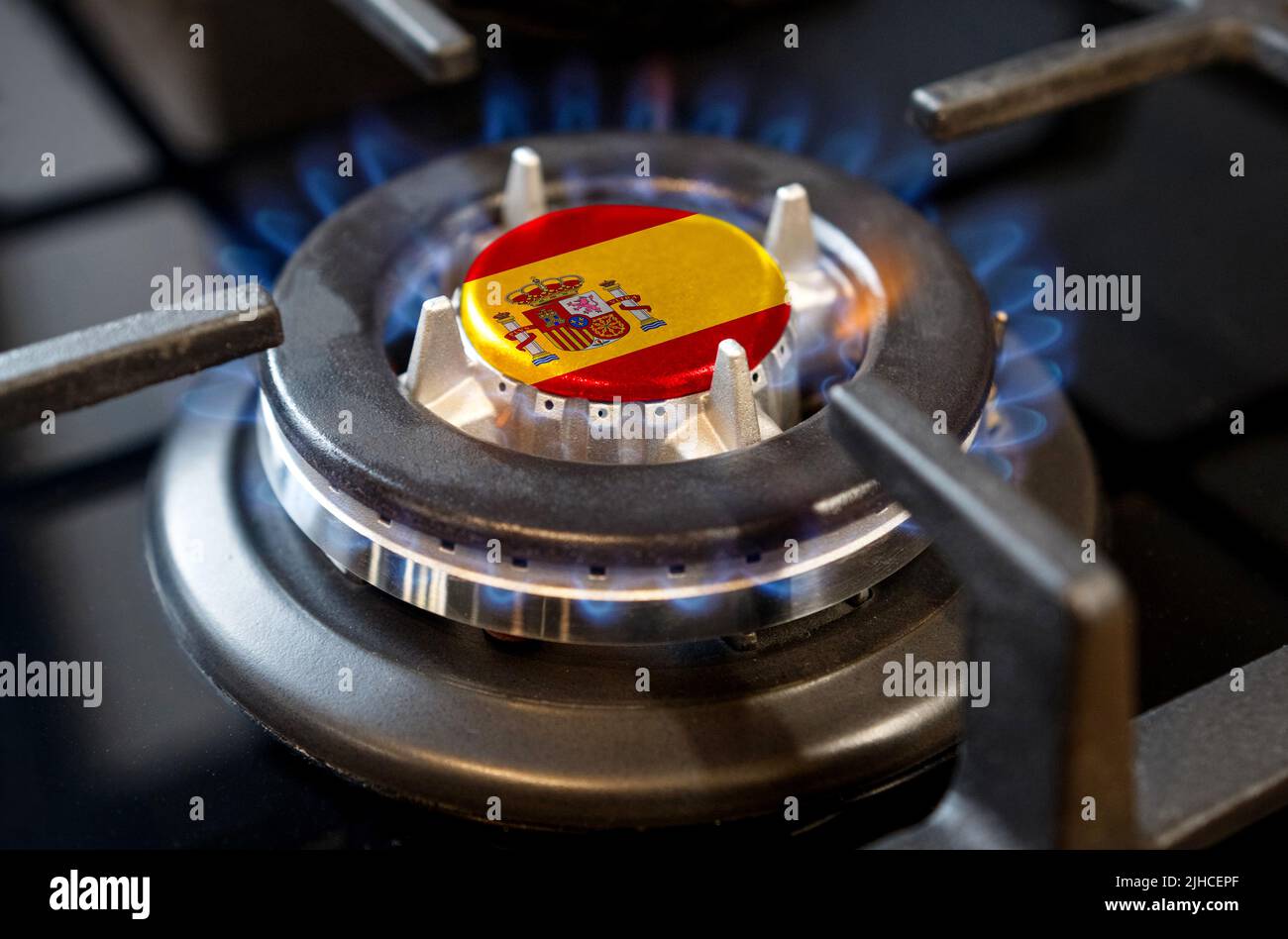 Gas import and export concept. A burning gas burner of a home stove, in ...