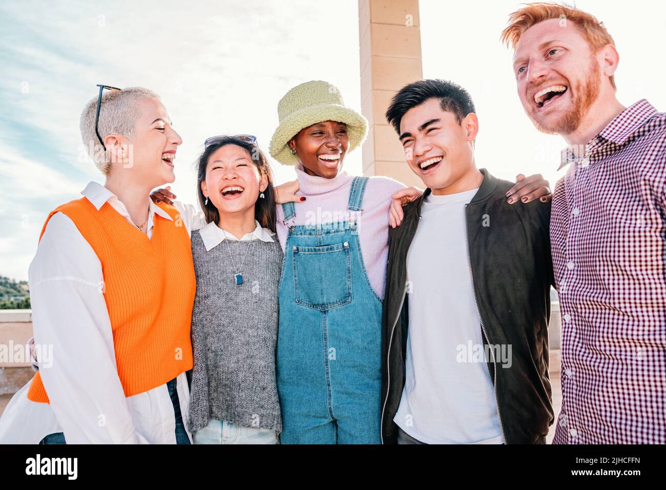 Group of multiracial friends meeting smiling and enjoying in a sunny ...