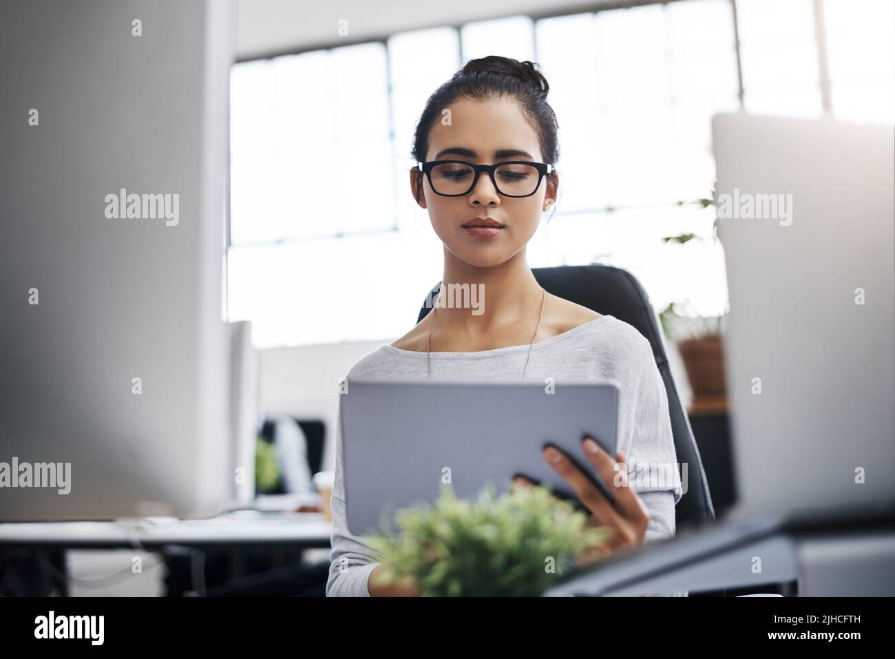 Her little productivity booster. a young businesswoman using a digital ...