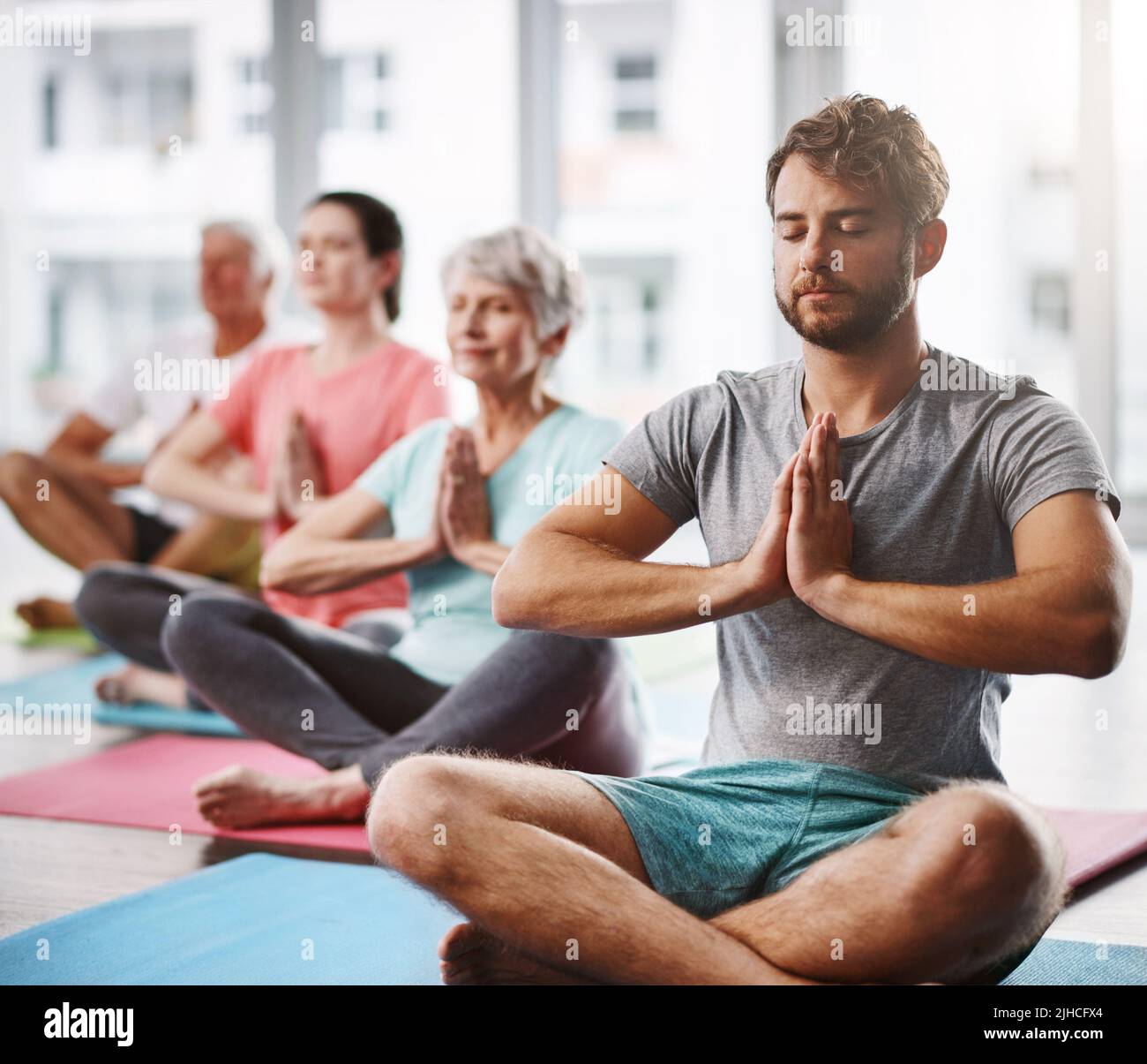 Group of people meditating hi-res stock photography and images - Alamy