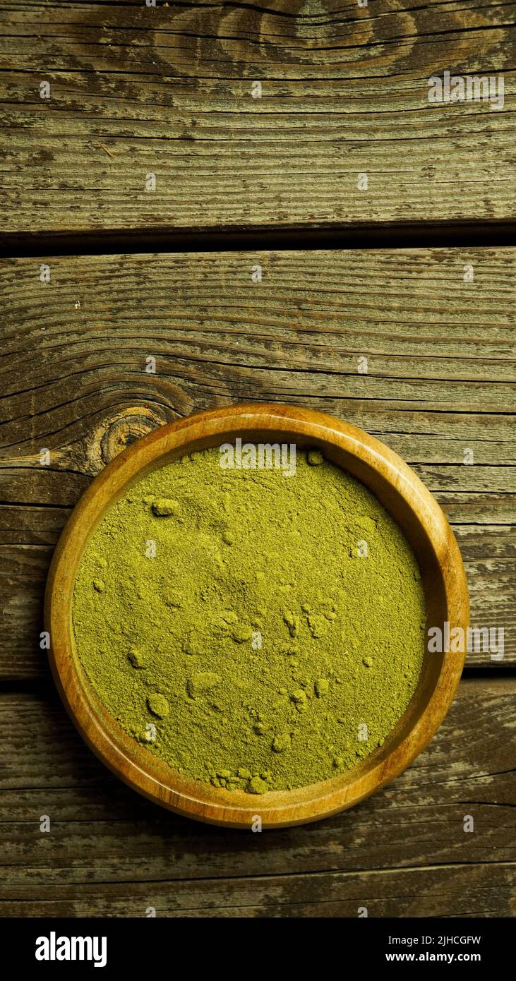 Moringa powder superfood very healthy plant in wooden bowl on wooden ...