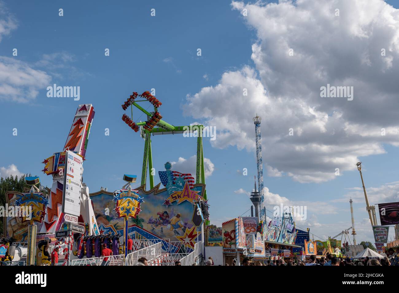 Outdoor sunny view of pendulum amusement ride, rotate and swing down ...