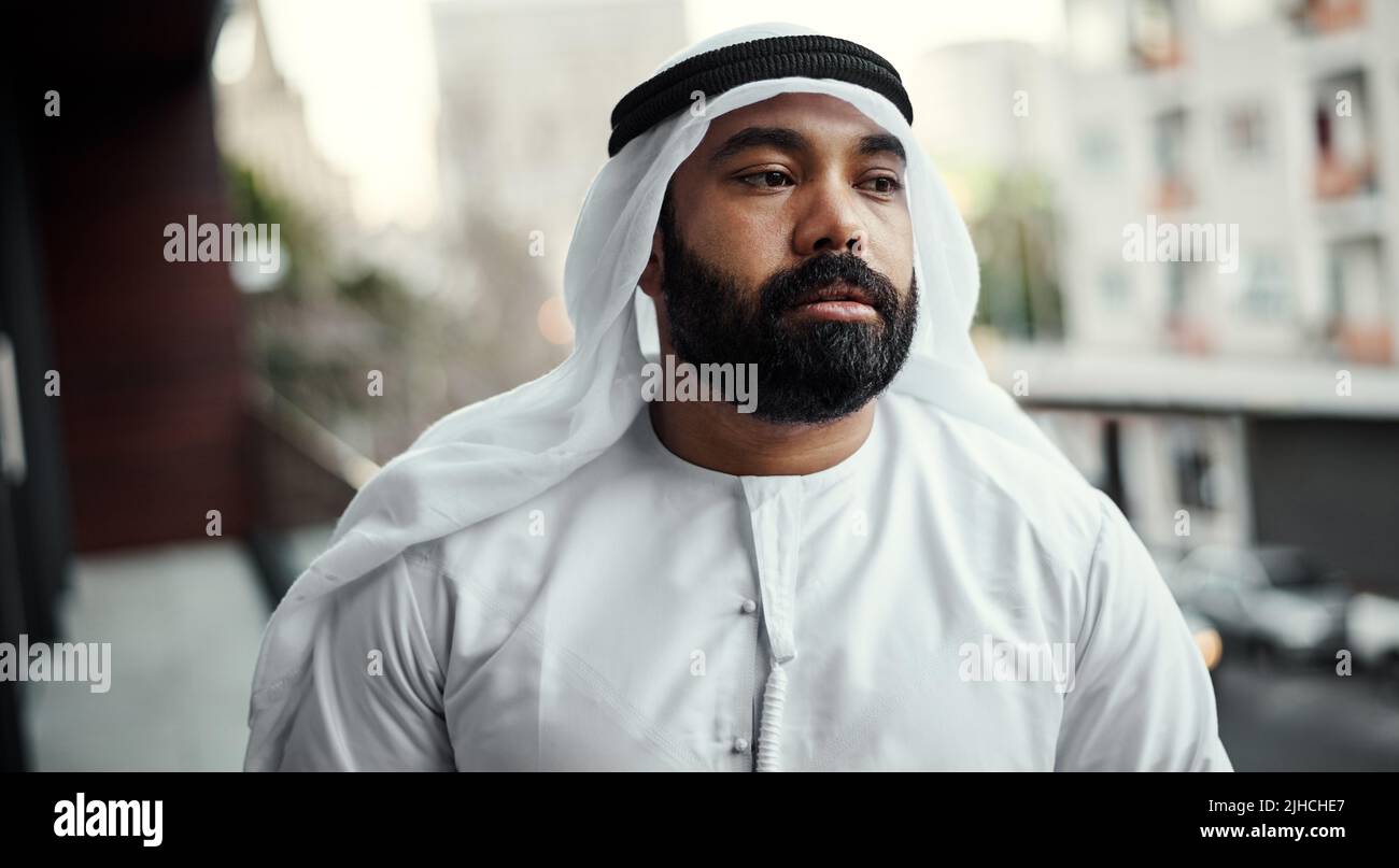 Some fresh air to fuel the mind. a businessman dressed in traditional ...