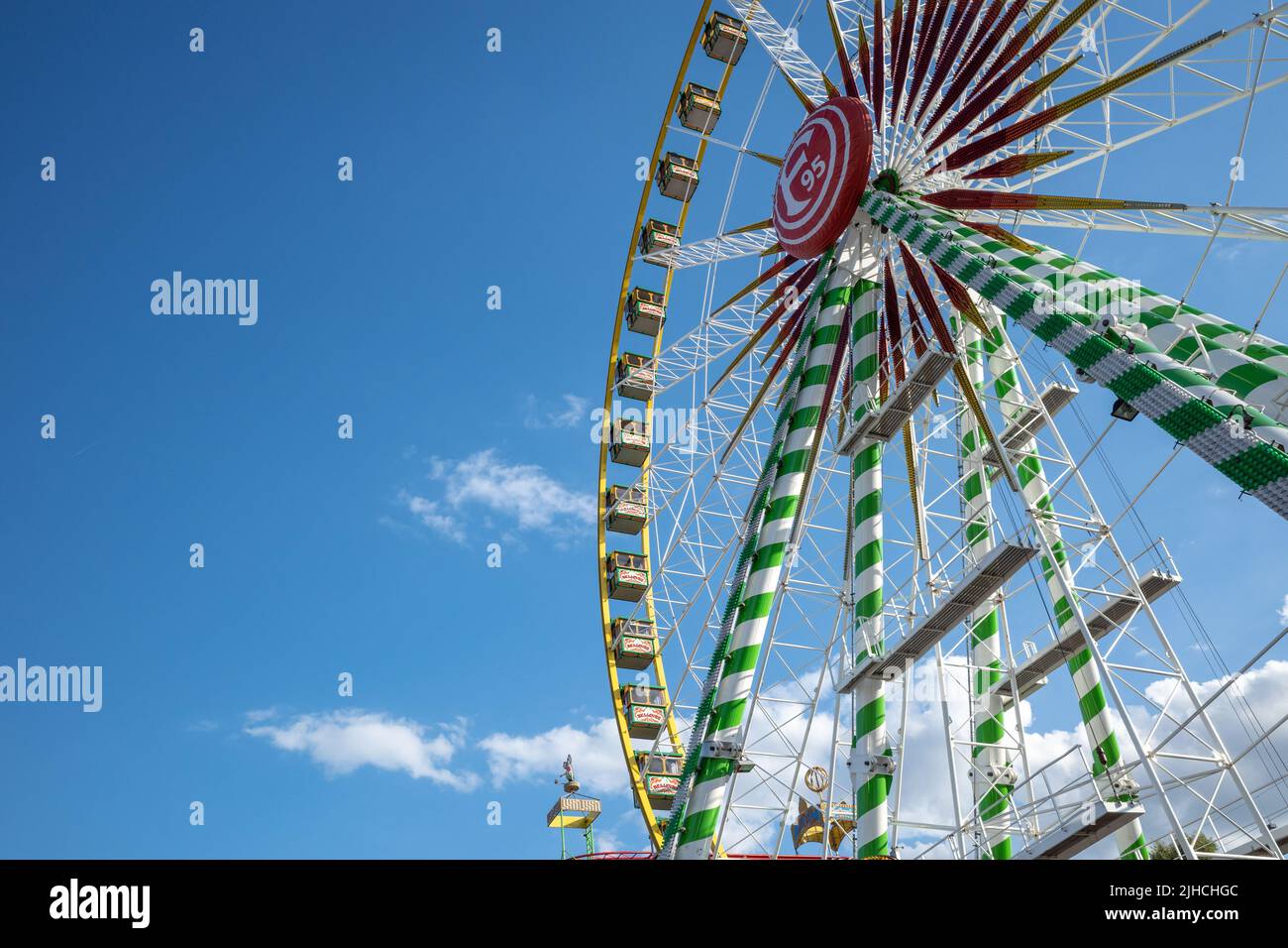 Low angle view of colourful illuminating Bellevue Ferris wheel, iconic ...