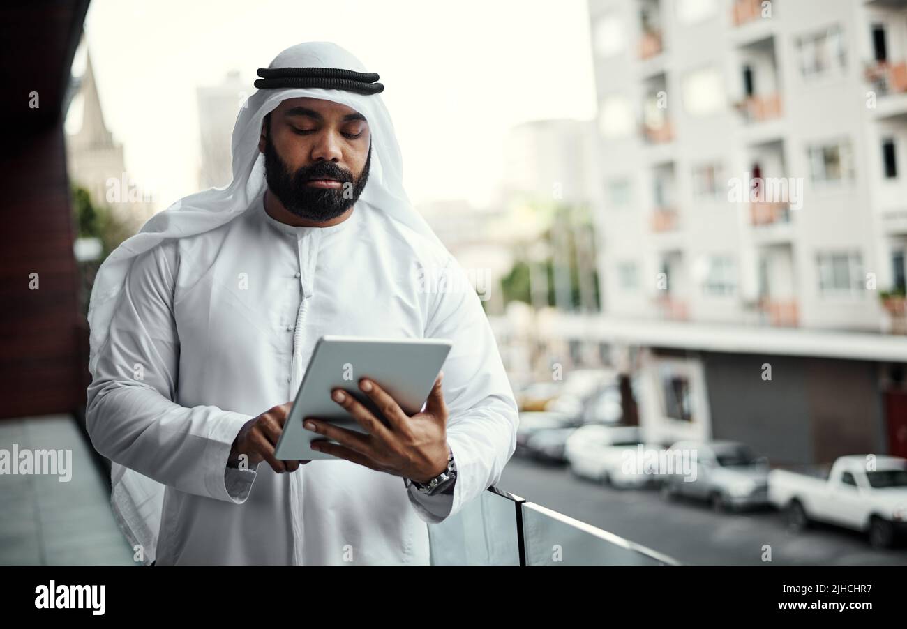 Hes connected to the city. a businessman dressed in traditional Islamic ...
