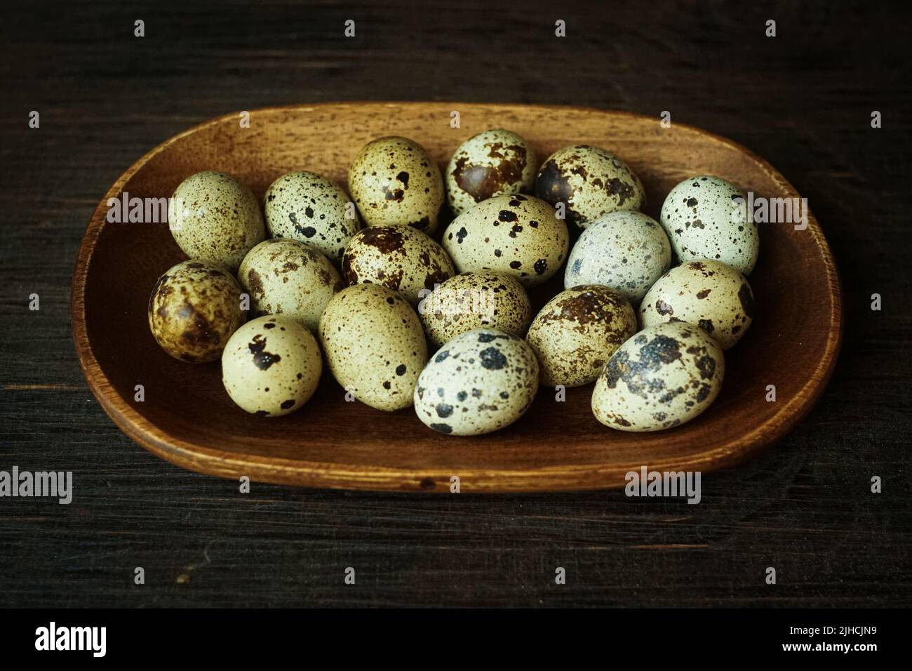Fresh quail eggs close up on a wooden table small hard boiled eggs ...