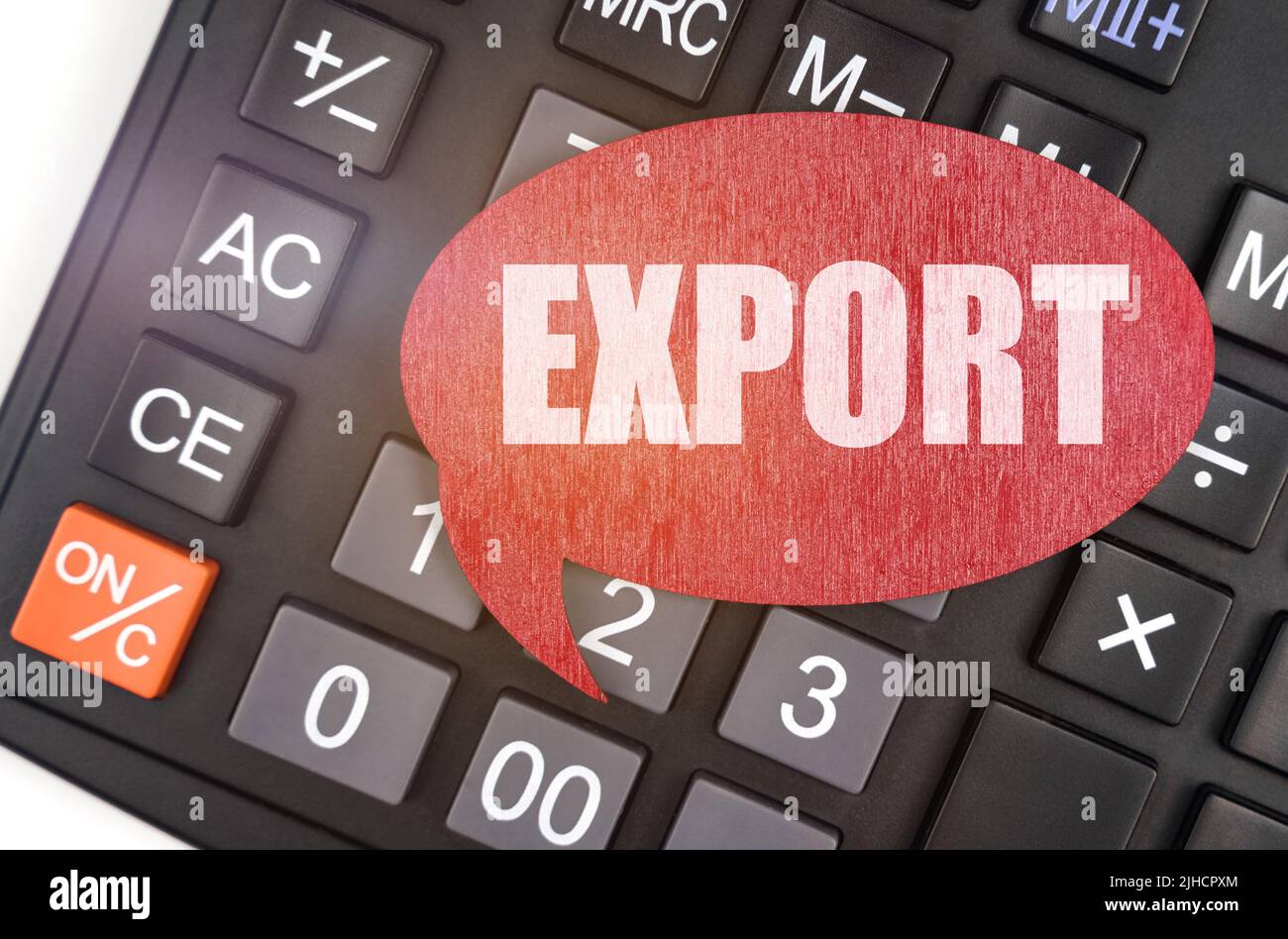 Business and finance concept. There is a red plaque on the calculator ...