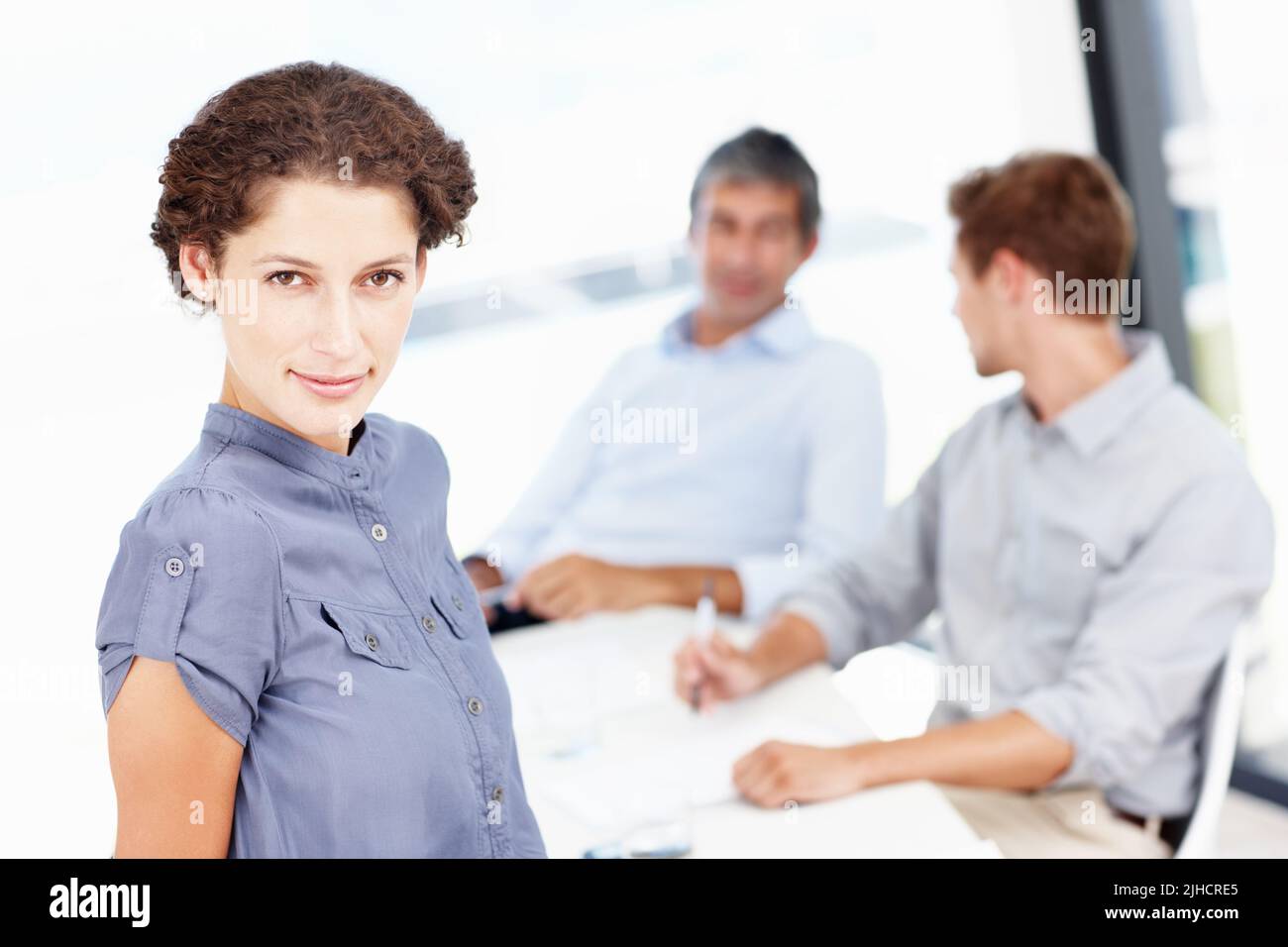 Boardroom positivity. Portrait of an attractive office worker with her ...