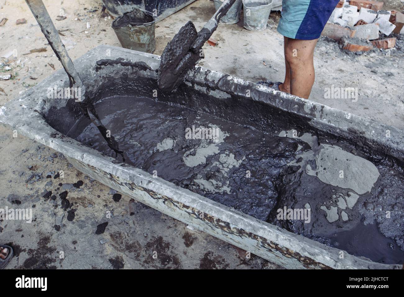 Hand construction worker mixing cement hi-res stock photography and ...