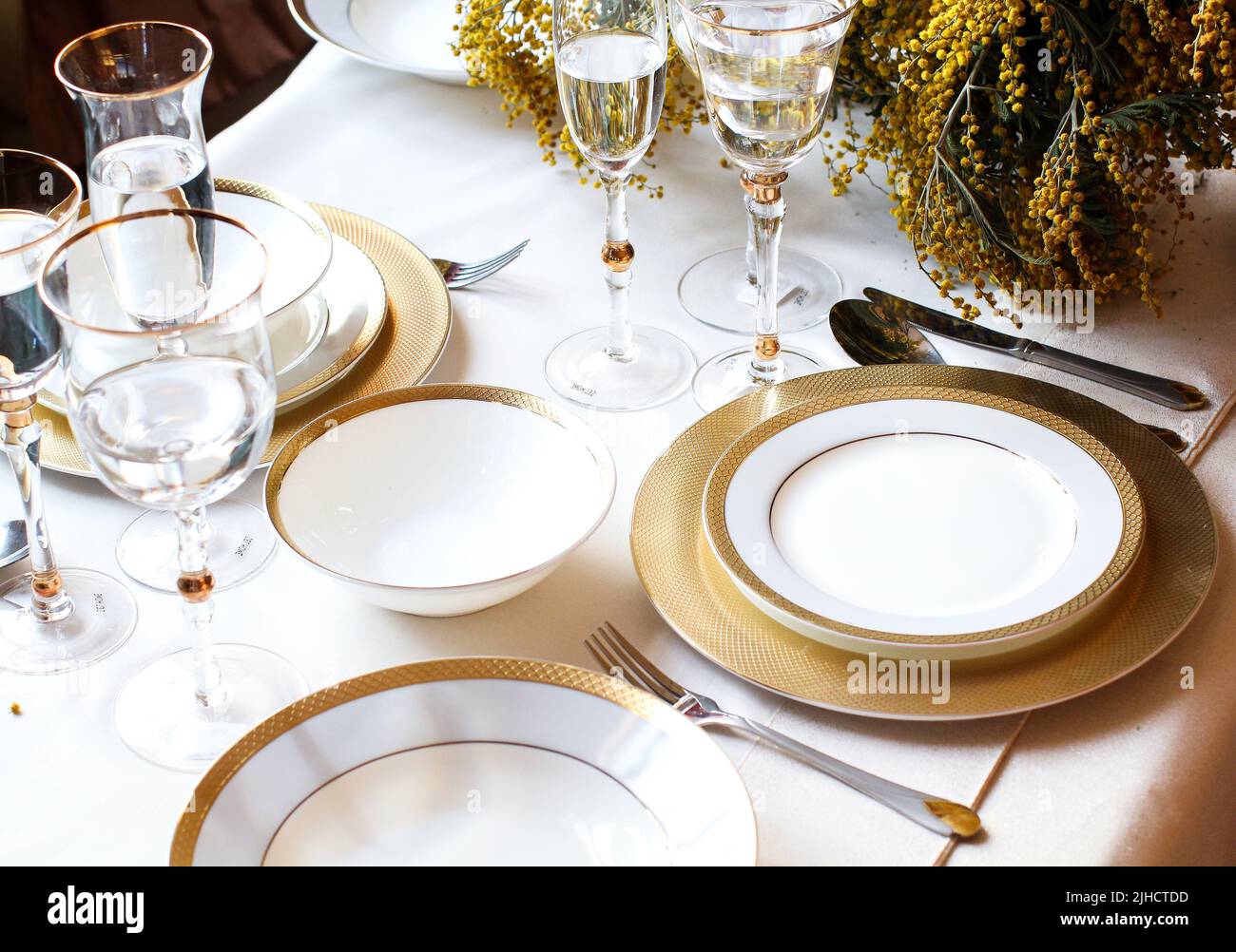 The beautiful ceremonial golden tableware with wild flower decoration ...