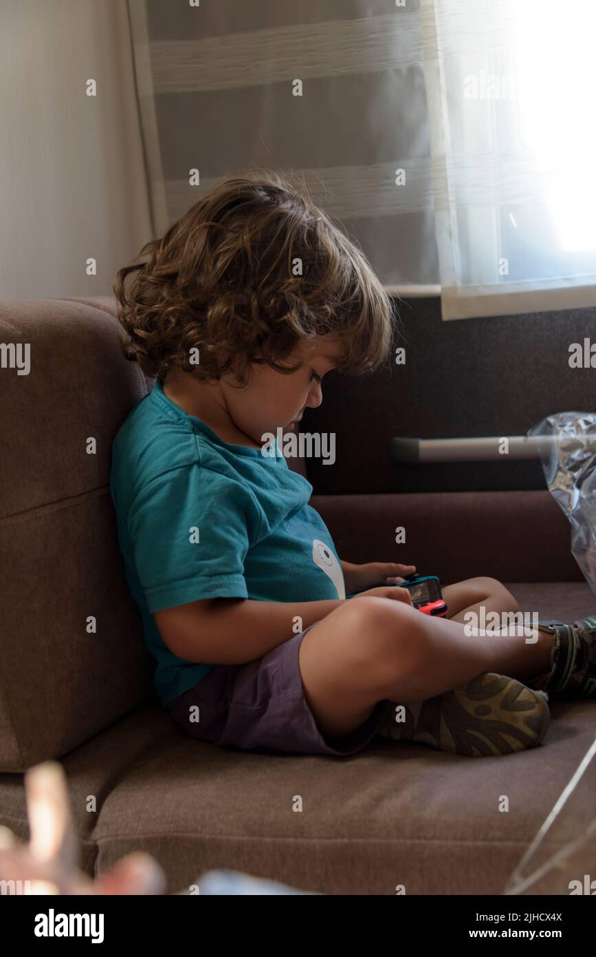 Happy little Boy Playing Video Games. Child using video game Controller ...