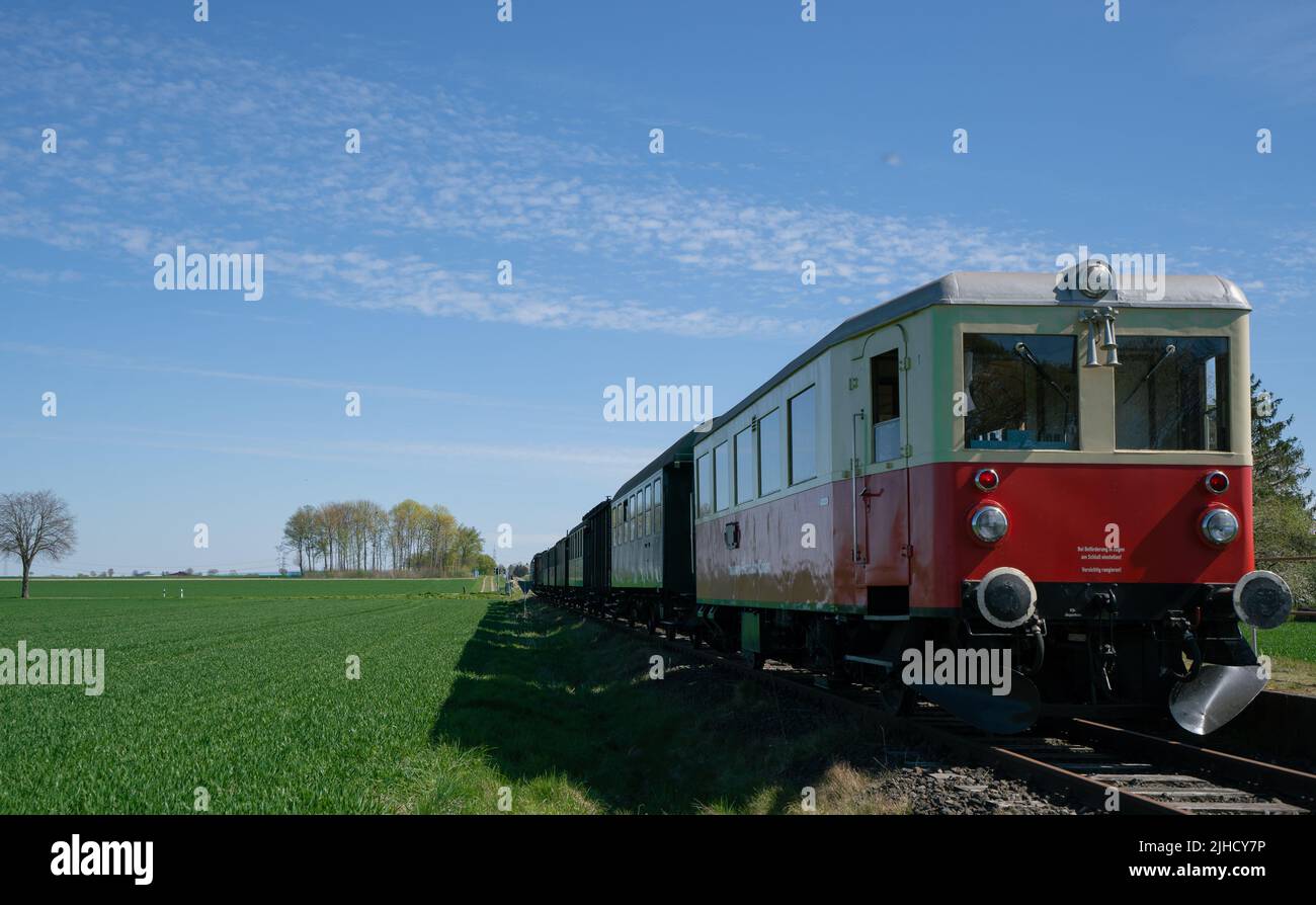 The red retro train wagon on a railroad in the countryside Stock Photo ...