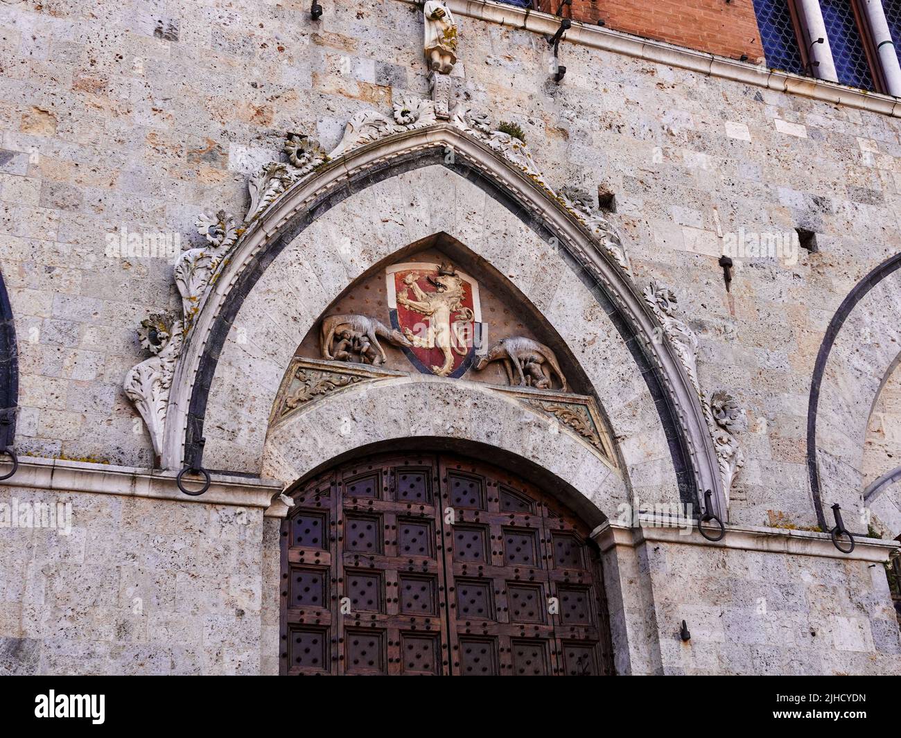 Lion crest, wolf suckling Romulus and Remus, Palazzo Pubblico, town ...