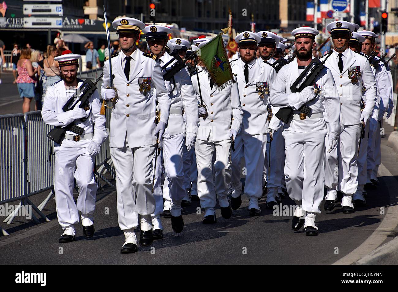 Members of the French naval armed forces parade march through the Old ...