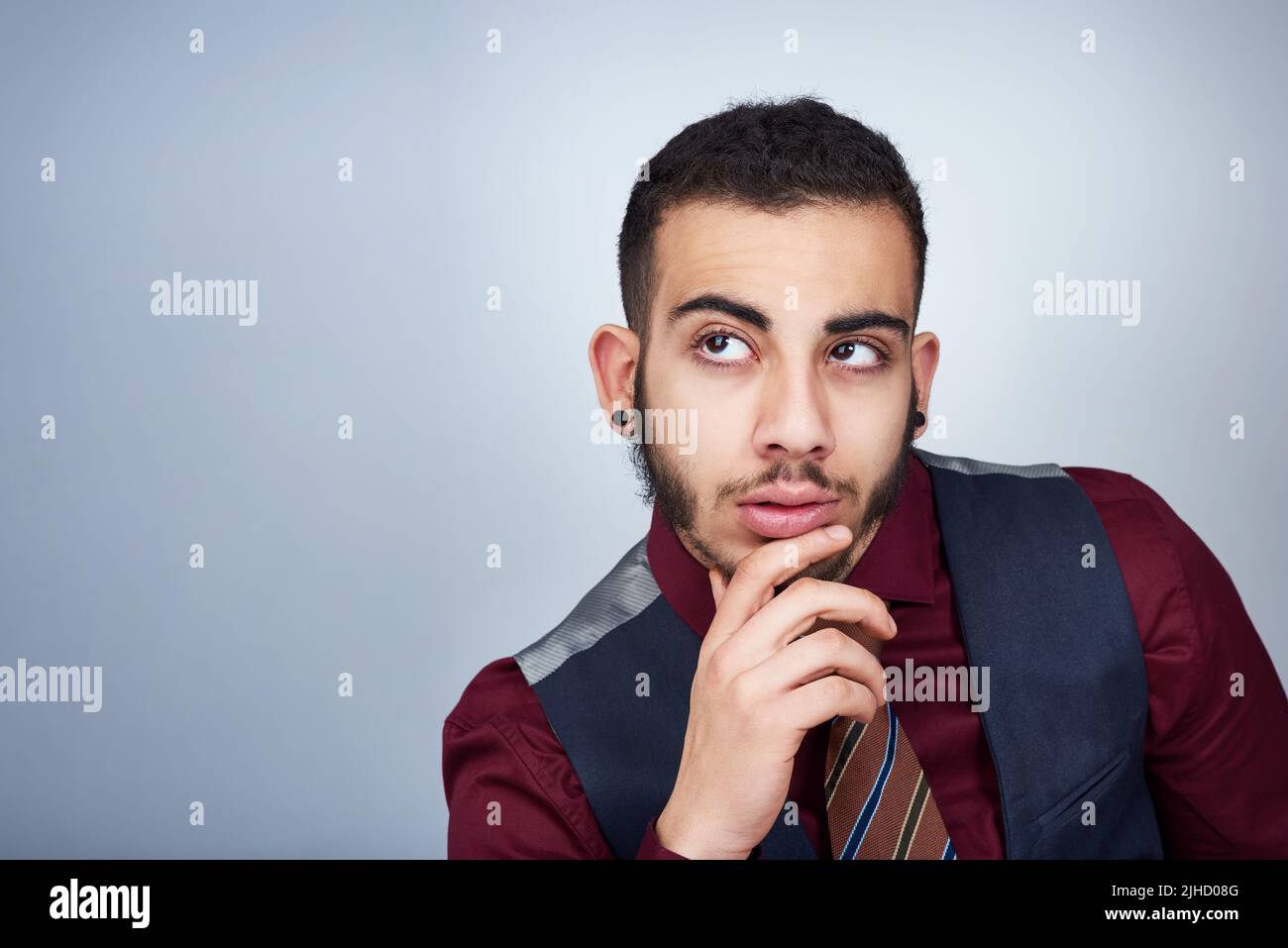 Thinking about my next business move. Studio shot of a handsome young ...