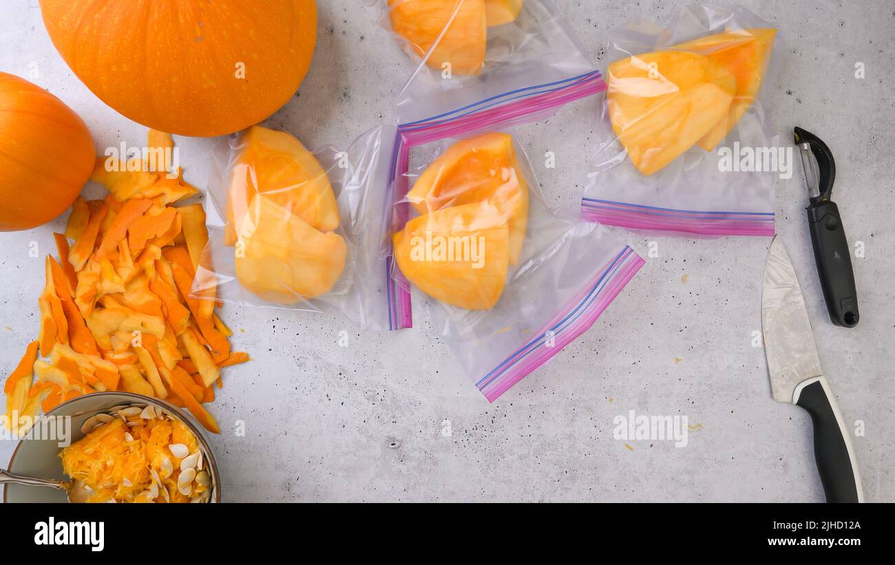 Fresh raw peeled pumpkin slices in zip lock bags close up, ready to be ...