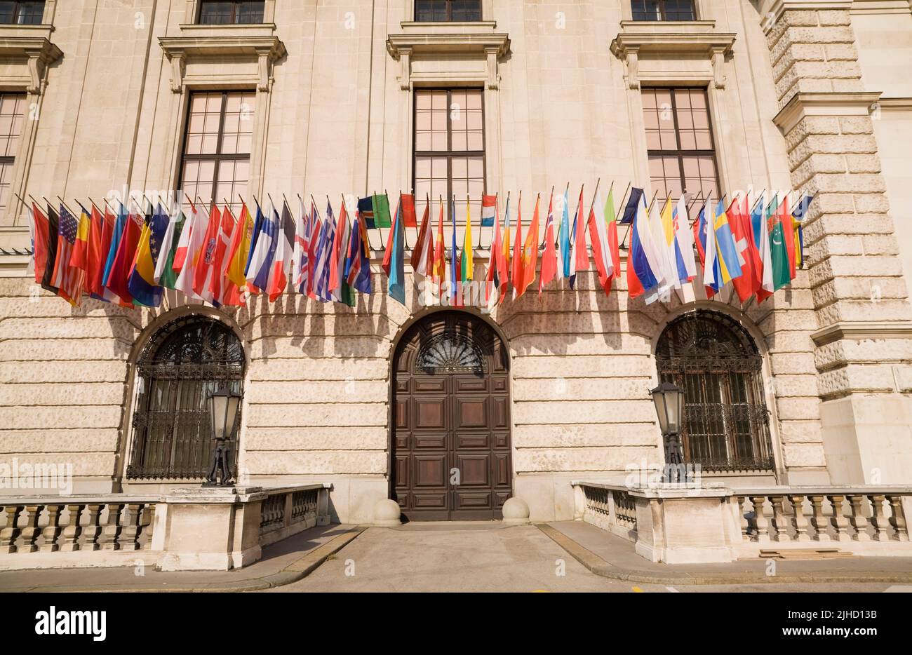 Old architectural style building with flags at the Hofburg Palace ...