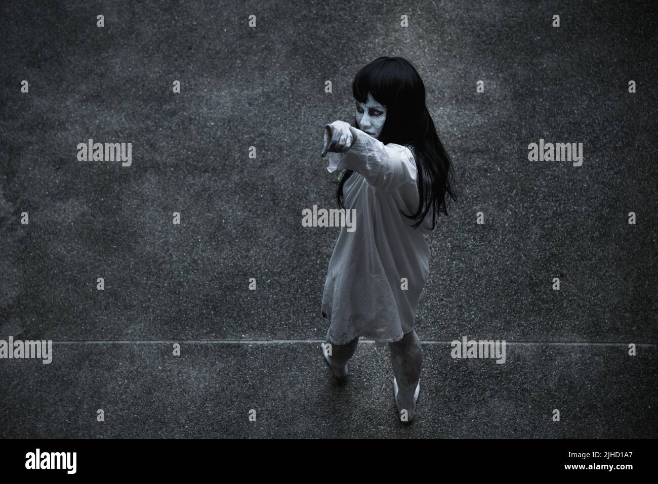 Woman ghost horror under building house point finger to your face ...
