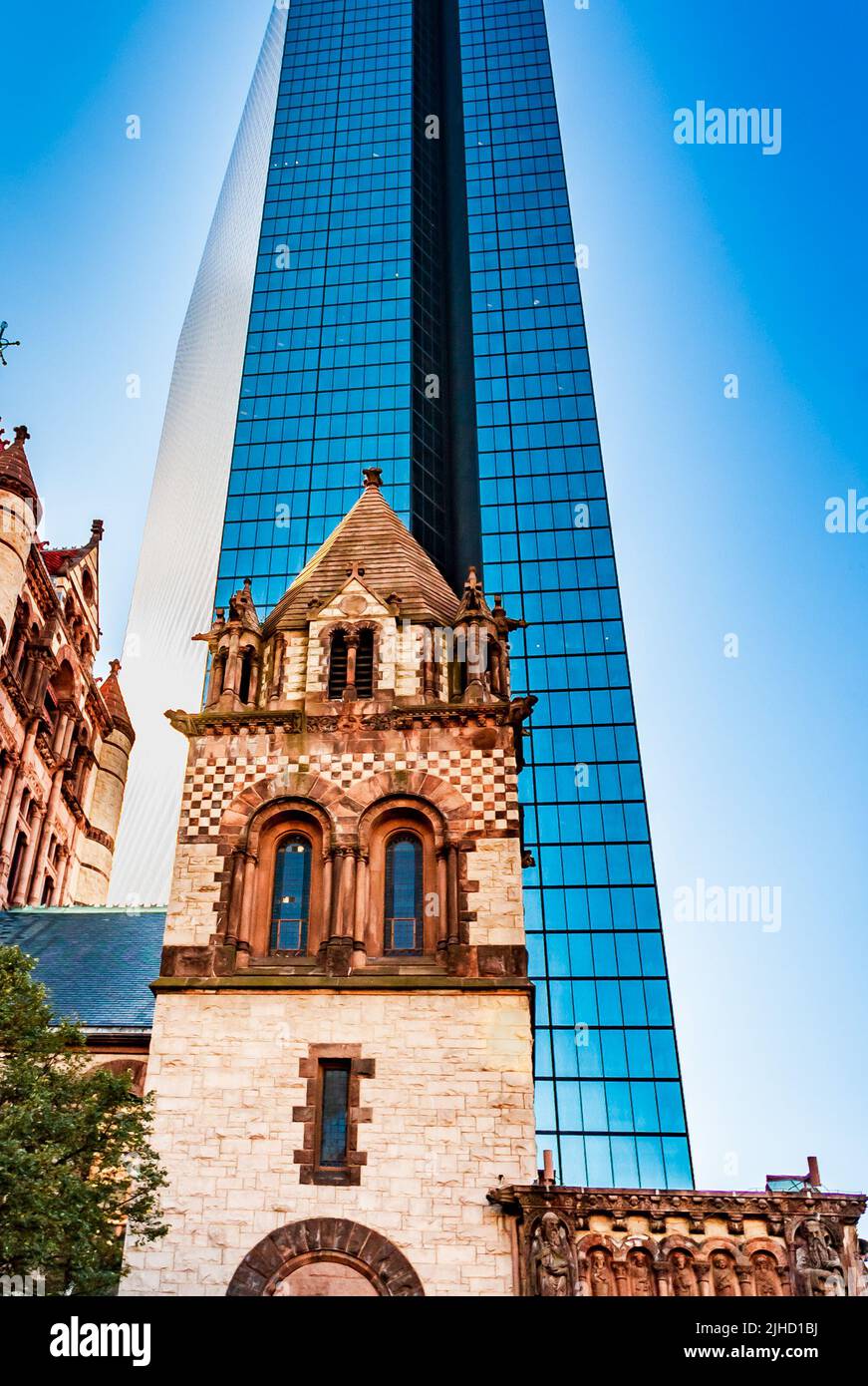 Top of Trinity church in front of Hancock Blue Tower merging into the ...