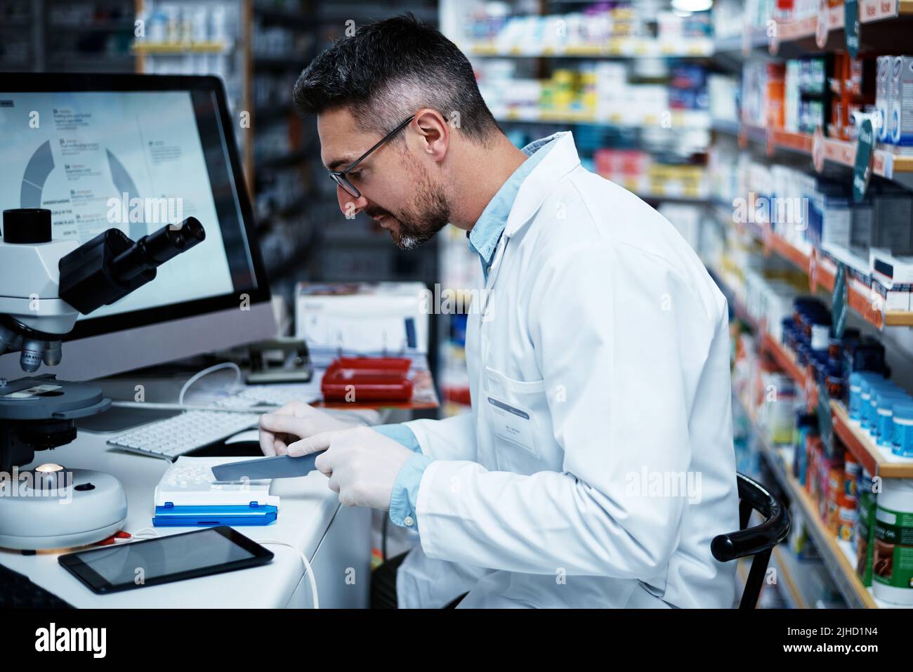 You can count on him to know the right dosage. a mature pharmacist ...