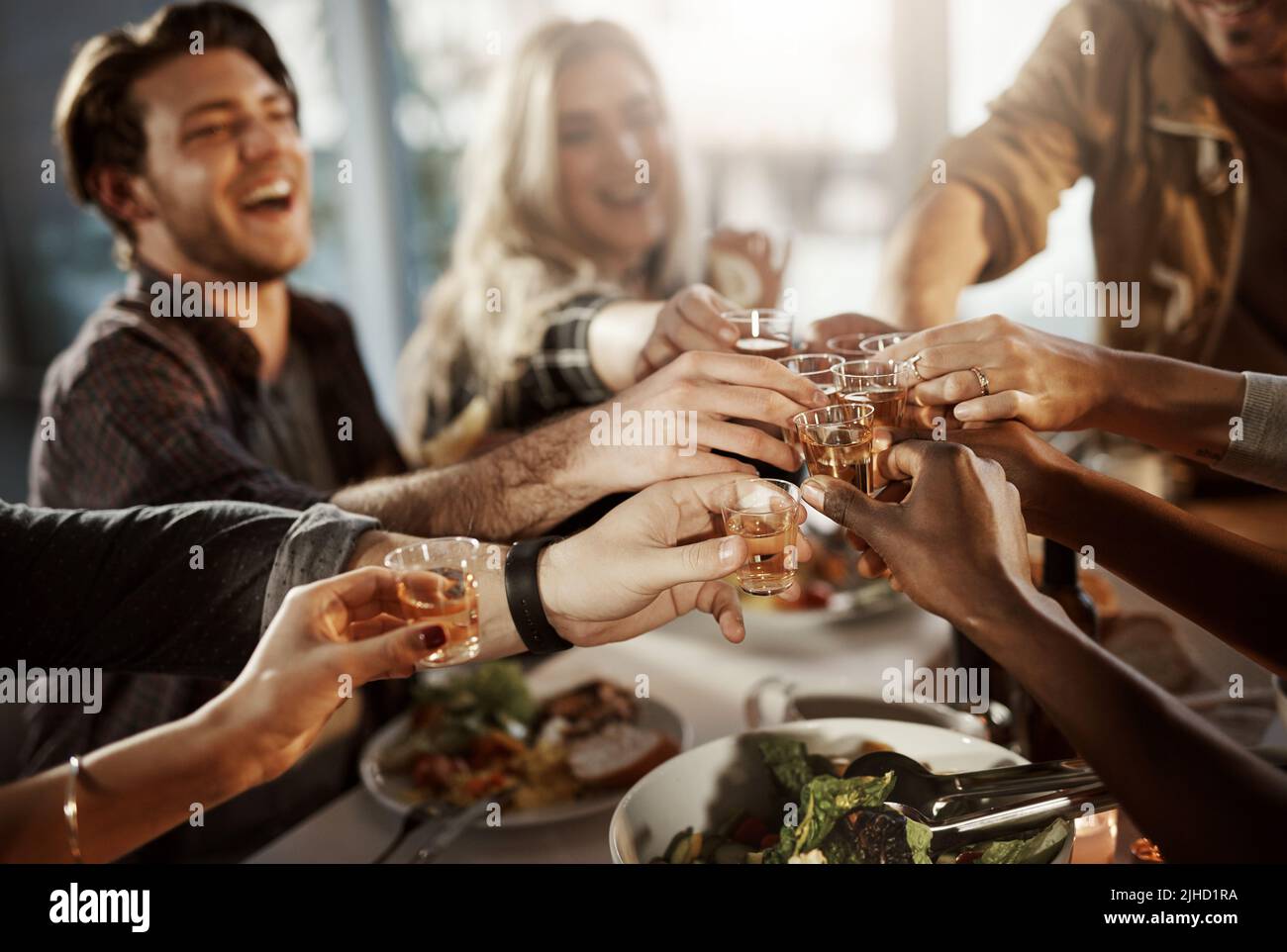 Friends know how to have fun. a group of young friends making a toast ...