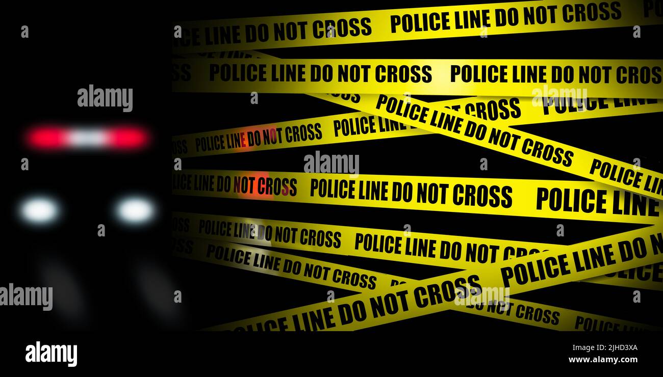 Yellow crime scene tape is seen with police lights and patrol car at ...