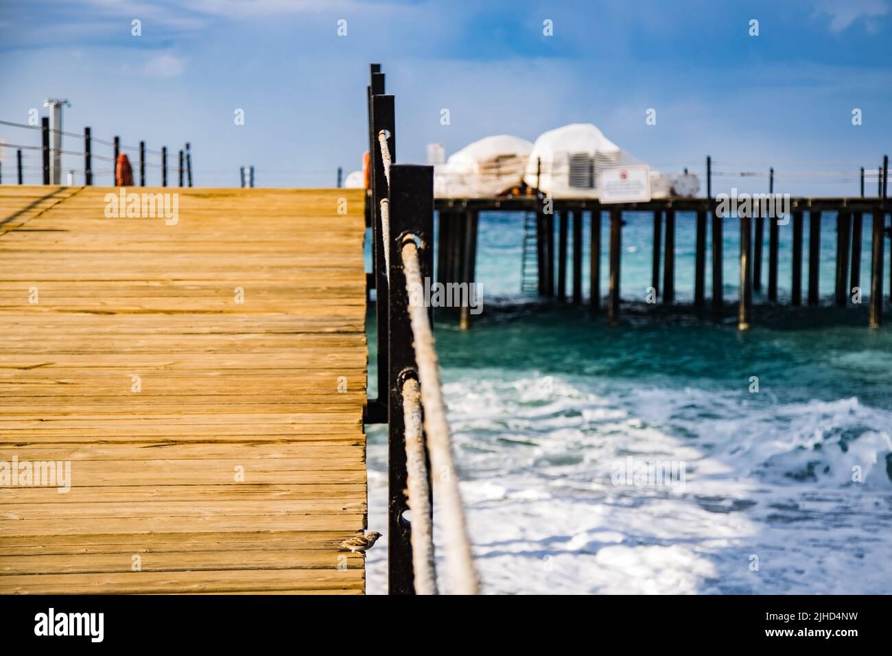 wooden pier in the mediterranean sea on a clear sunny day, view from ...