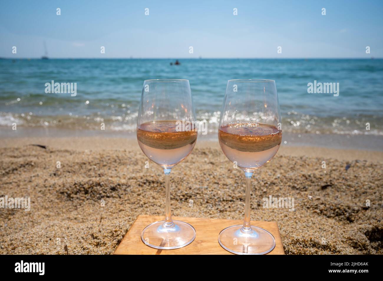 Cold rose wine from Provence served outdoor on white sandy beach Plage ...