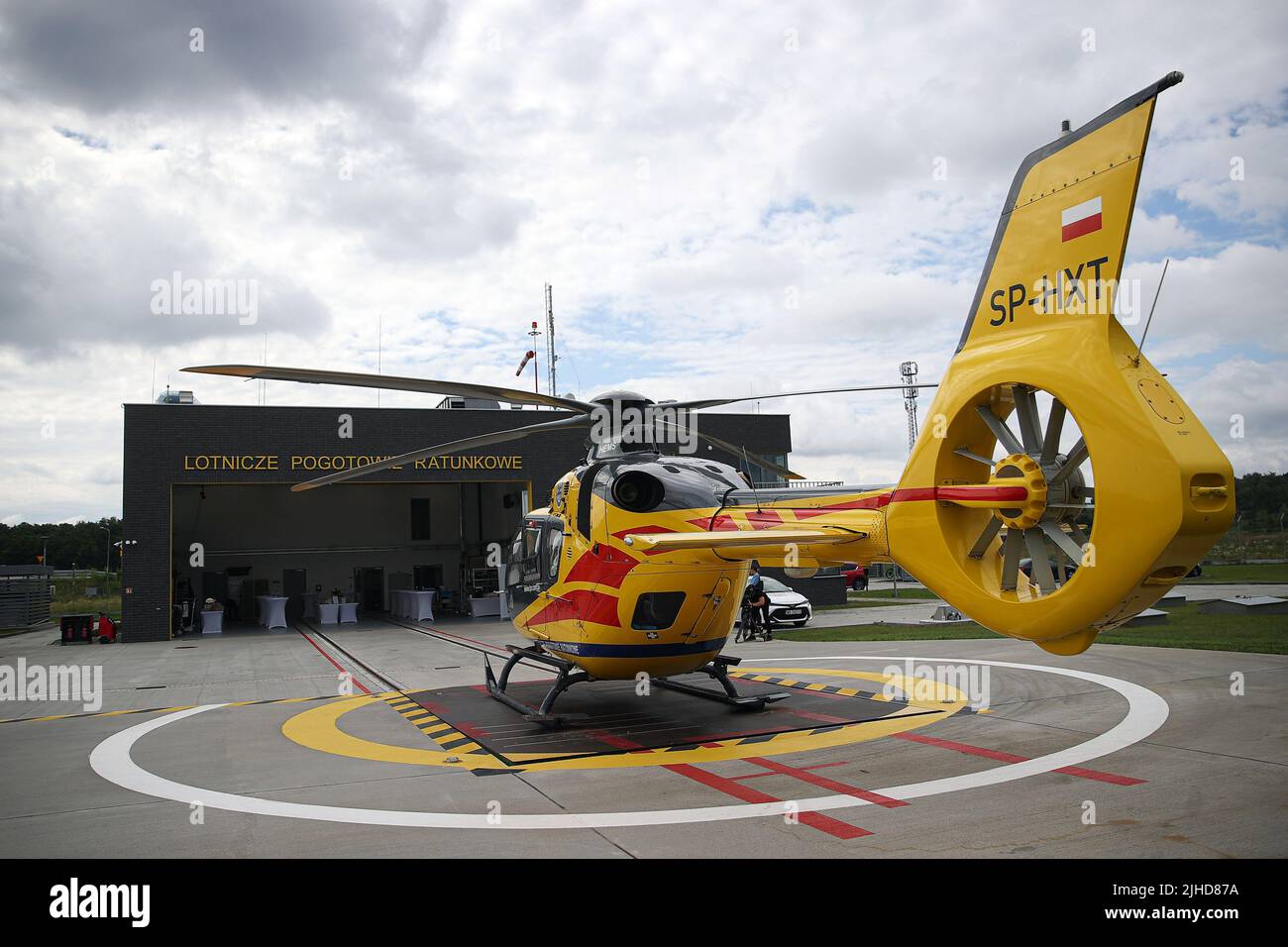 An emergency medical helicopter on a landing pad with the air ambulance ...