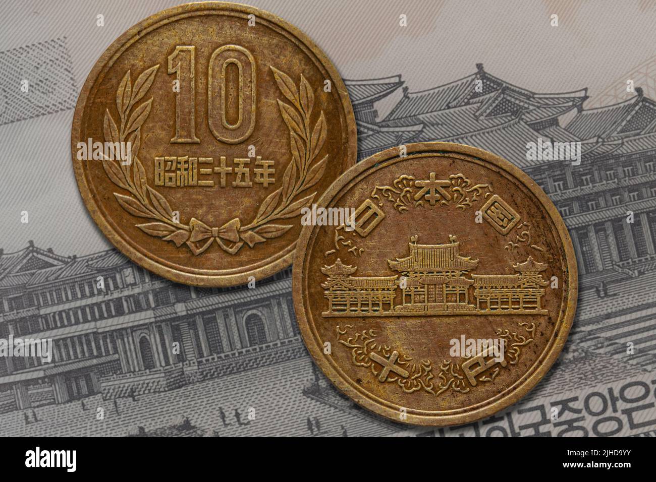 Golden Japanese Yen coins on a paper Stock Photo - Alamy