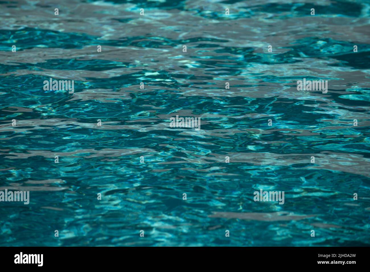 Abstract ripple wave and clear turquoise water surface in swimming pool ...