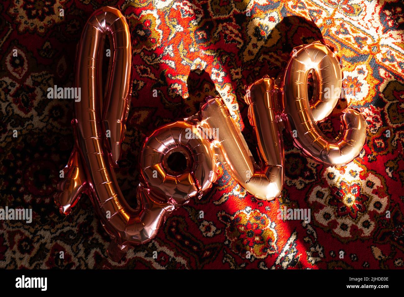 Love text pink foil balloon on authentic Love word from pink inflatable ...