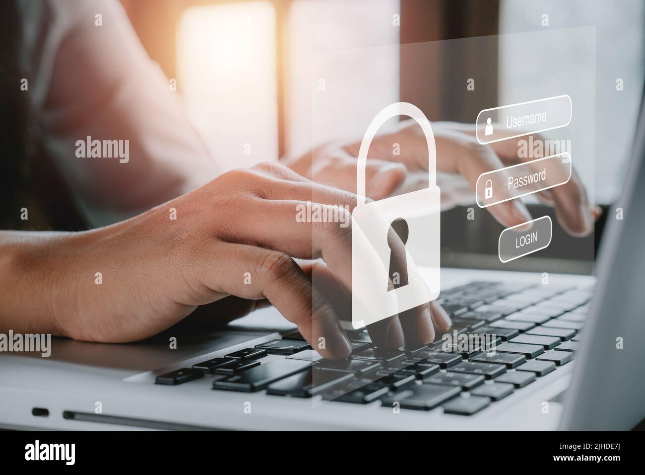 Woman hand typing on keyboard with login and password on screen display ...