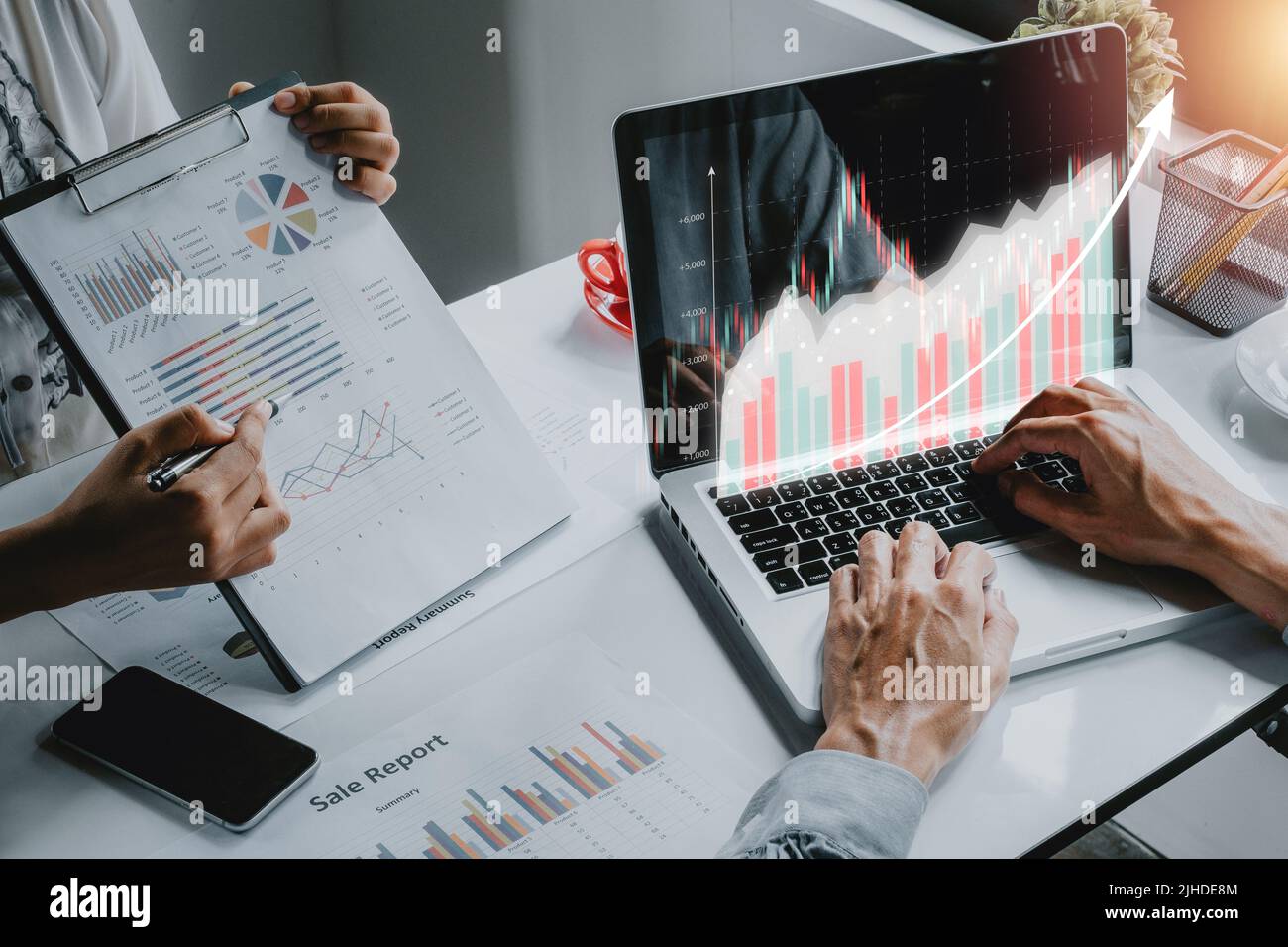 Business team analyzing income charts and graphs, Business team working ...