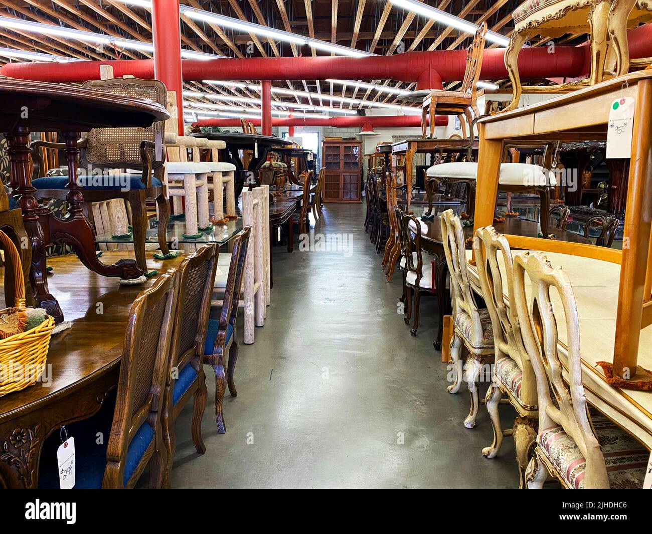 Rows of tables and chairs in a furniture store Stock Photo - Alamy