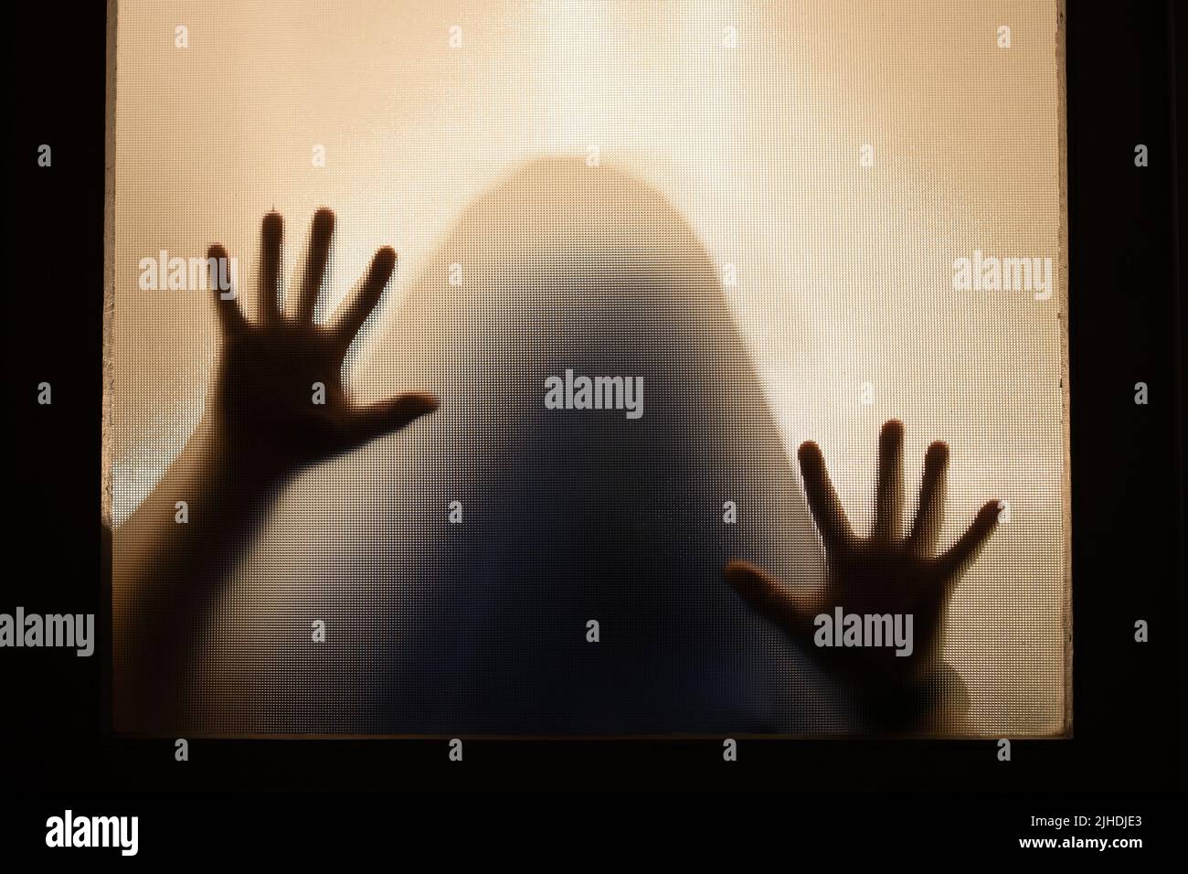 Horror ghost figure behind the matte glass. Halloween festival concept ...