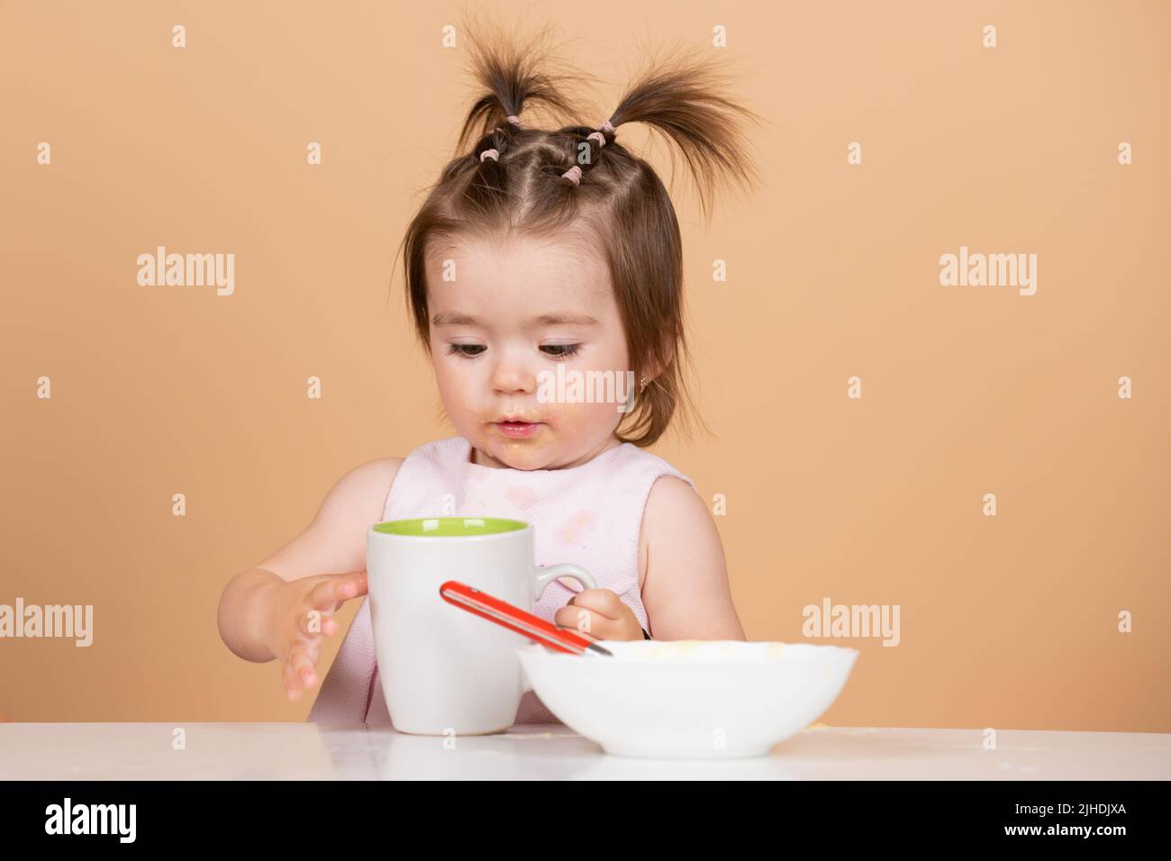 Babies eating, healthy food for a baby. Babys first meal. The child ...