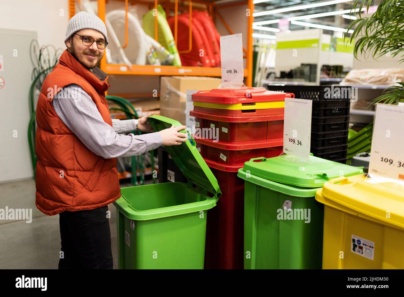 the buyer in the store chooses containers for separate waste collection ...